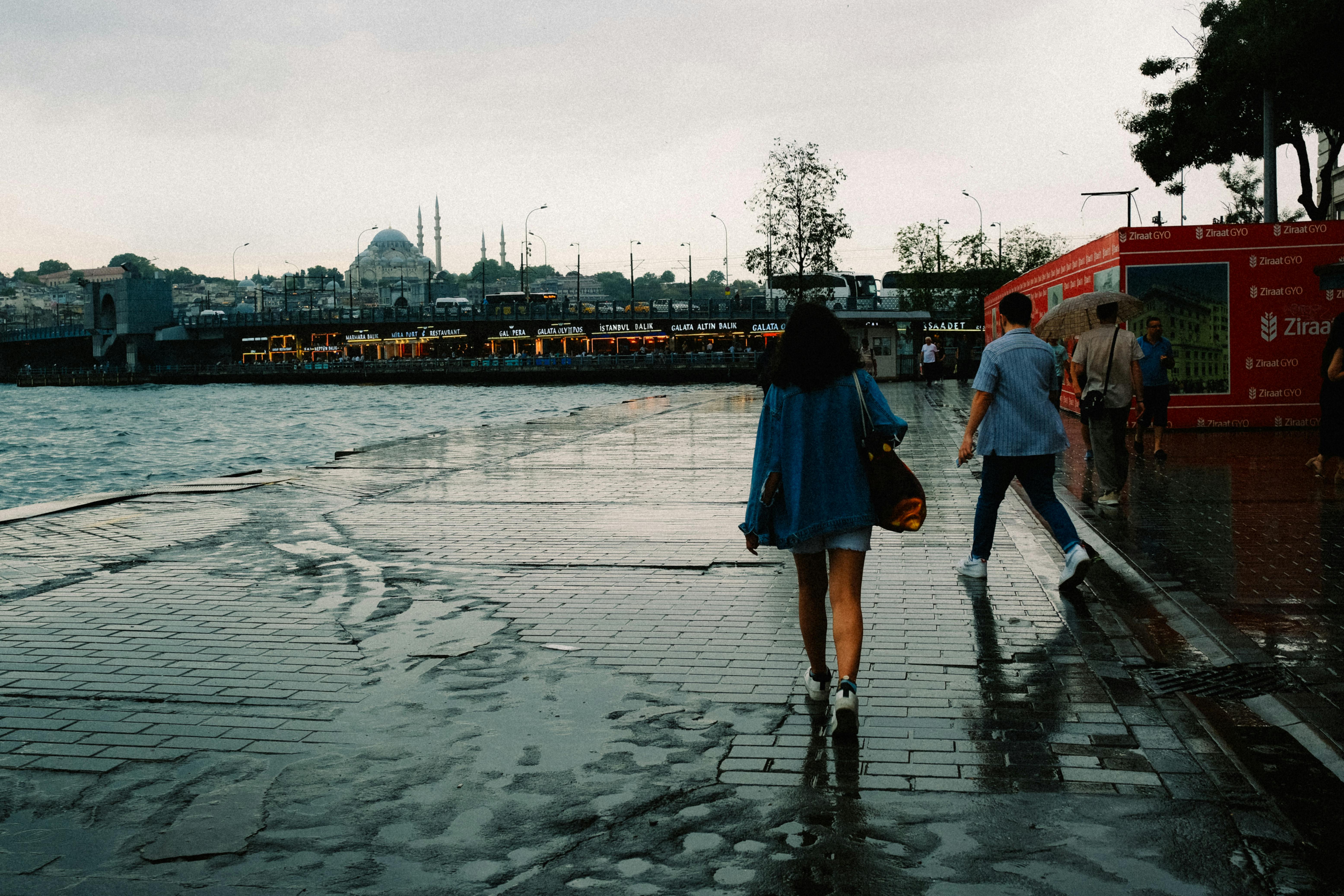 People on the Sidewalk by the Water in Istanbul, Turkey · Free Stock Photo