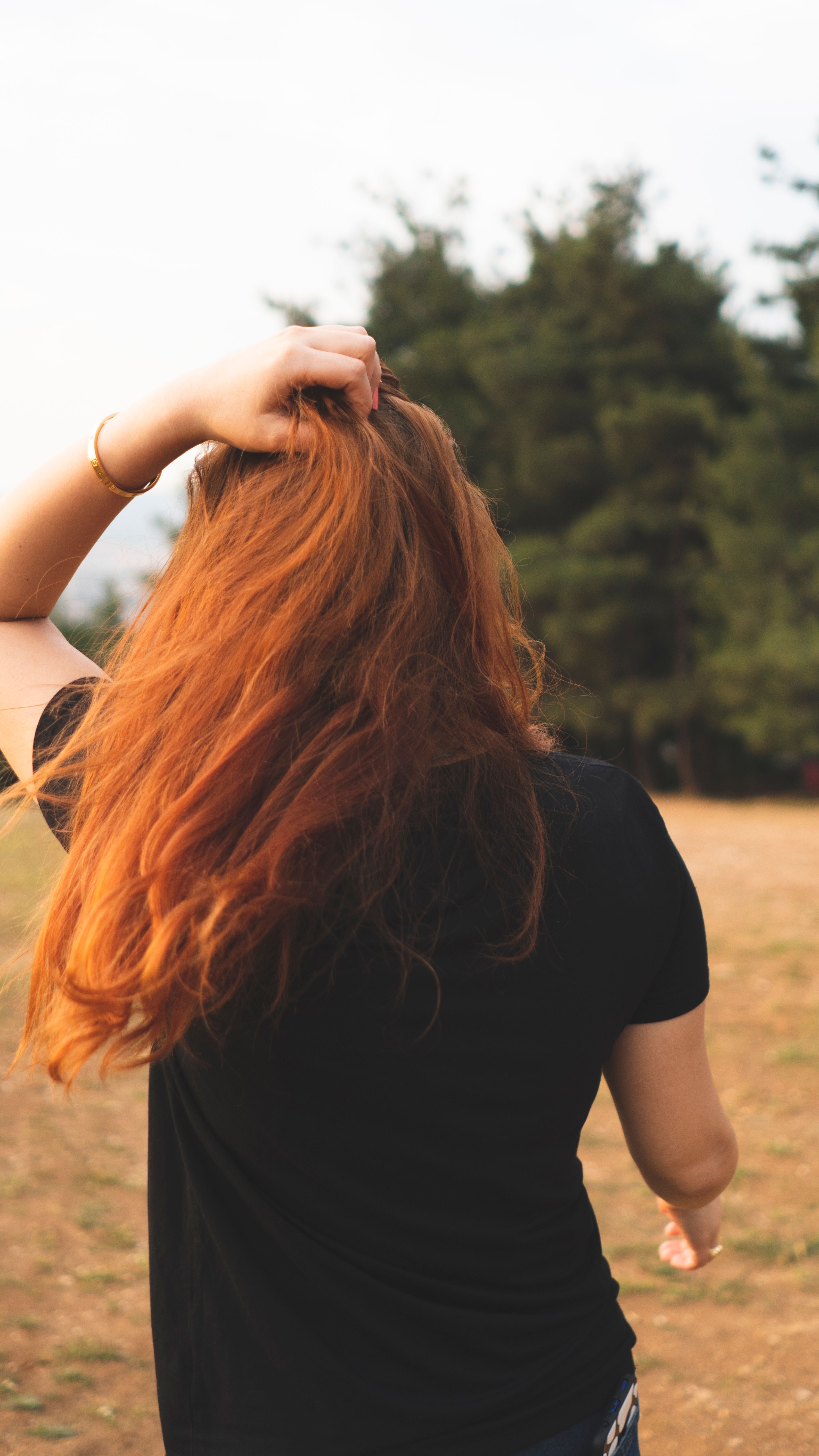 Back View of a Redhead Woman in Black Shirt · Free Stock Photo