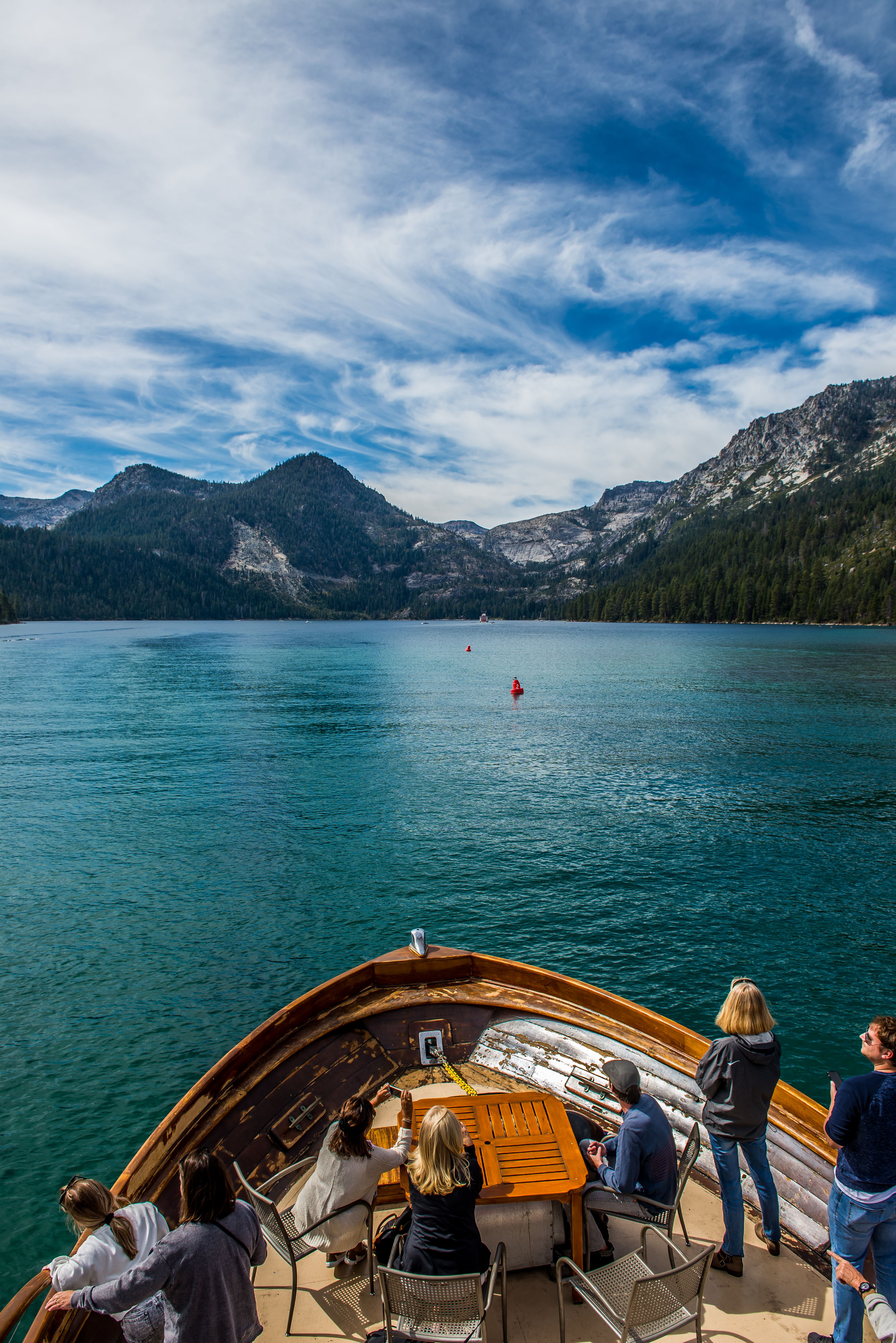People on a Boat Sailing with the View on Sierra Nevada Mountain Range ...