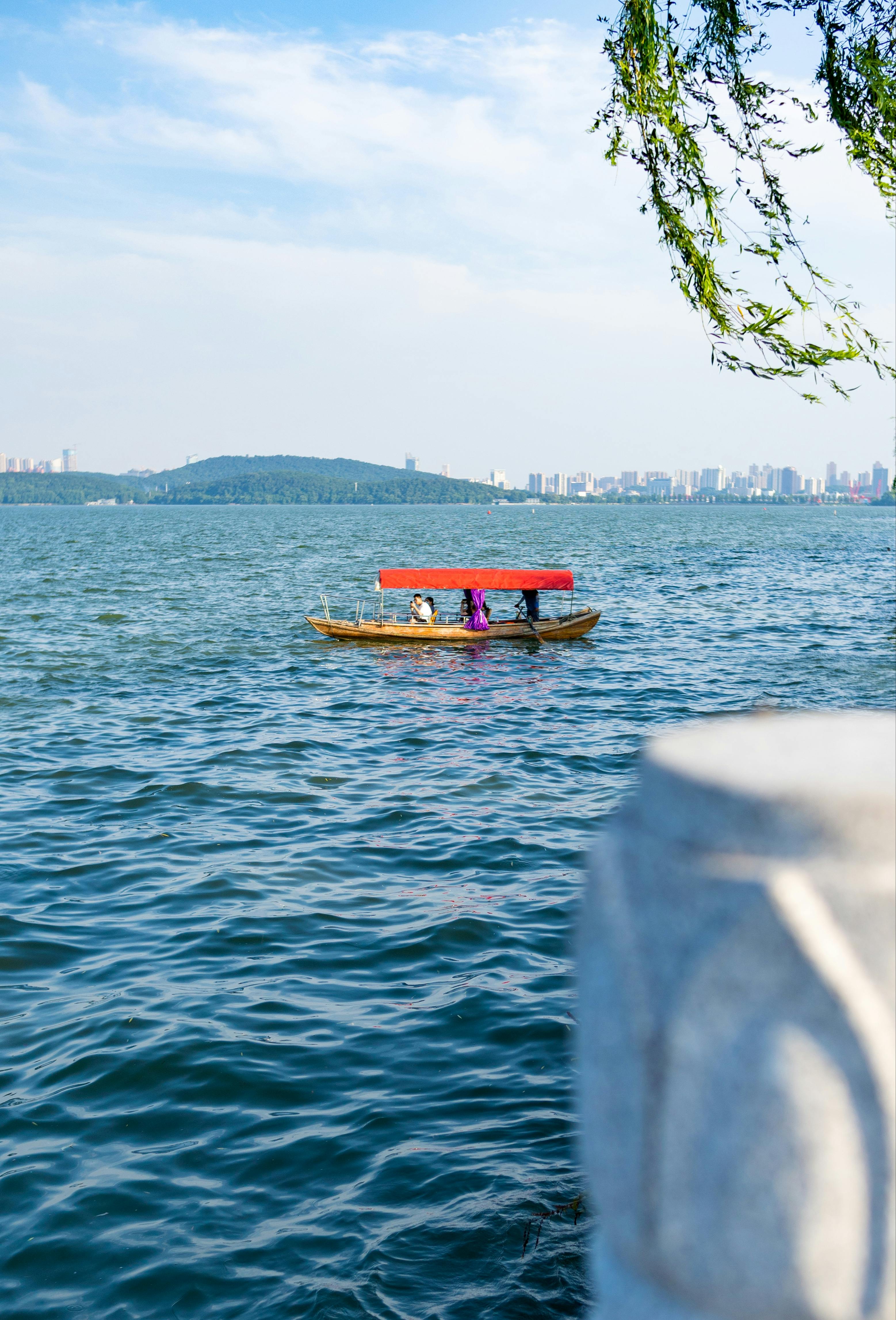 Small Rowboat with Flags Flying in Wind · Free Stock Photo