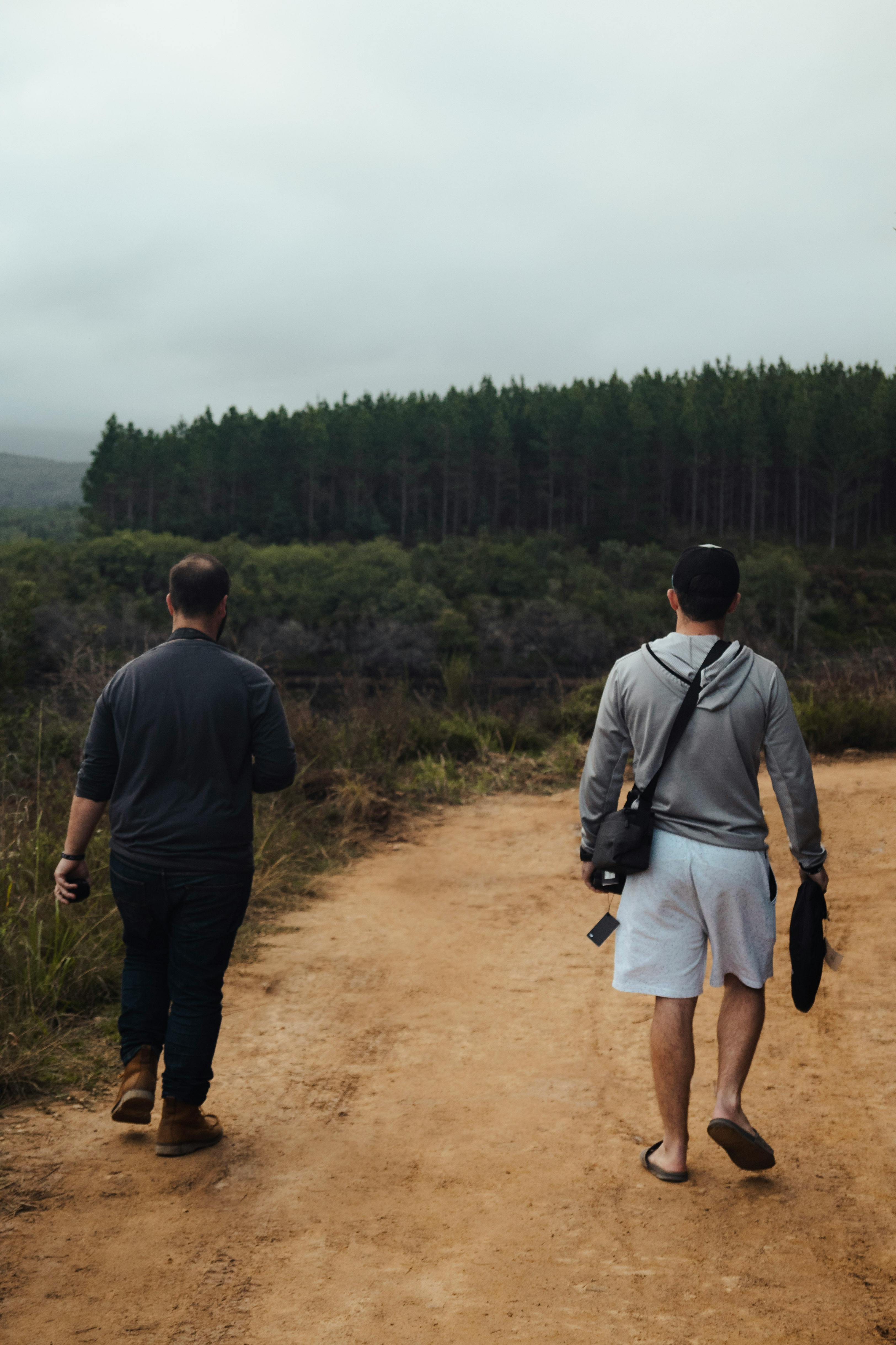 Man Walking on Grass Field · Free Stock Photo