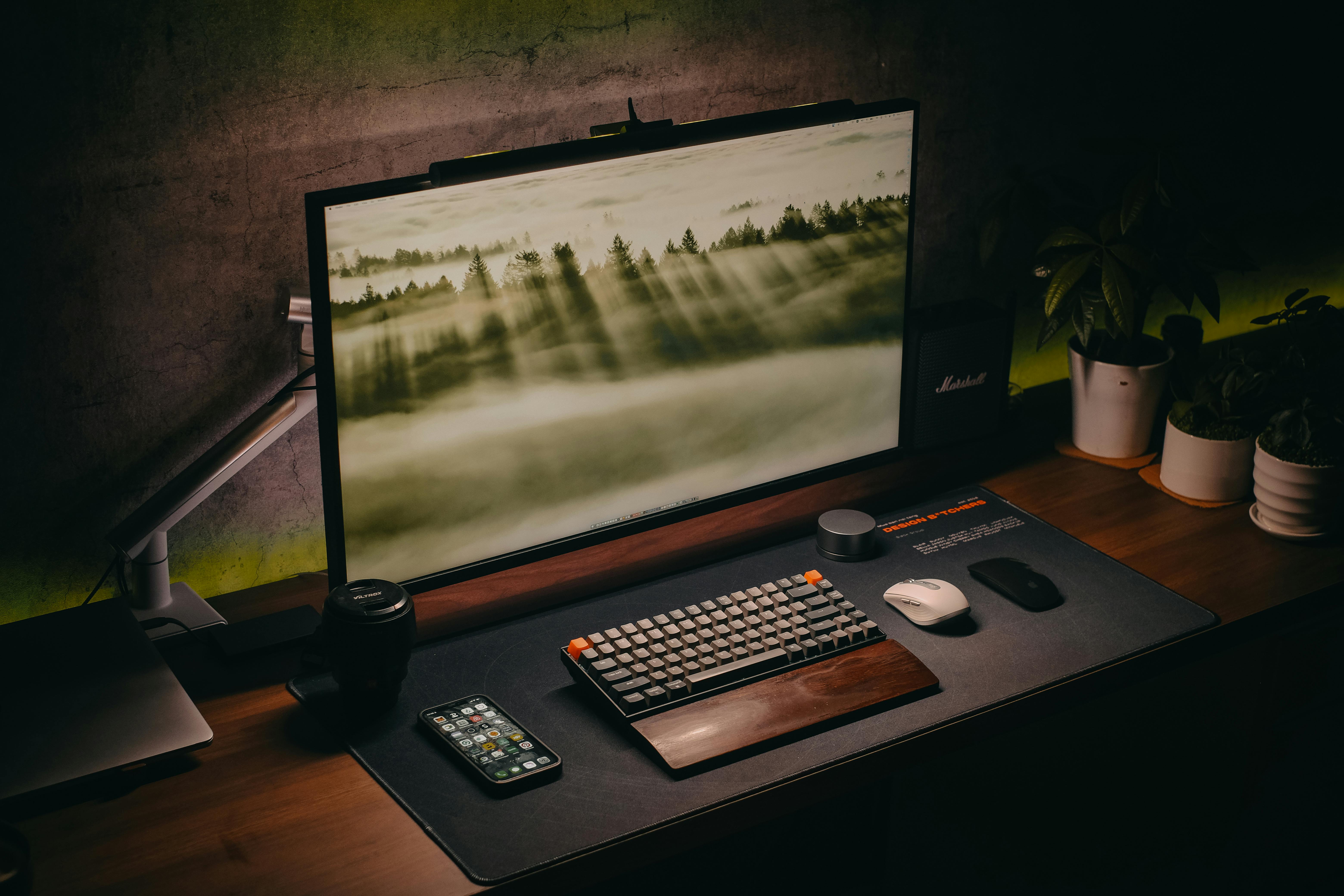 Macbook Pro Surrounded by Assorted Items · Free Stock Photo