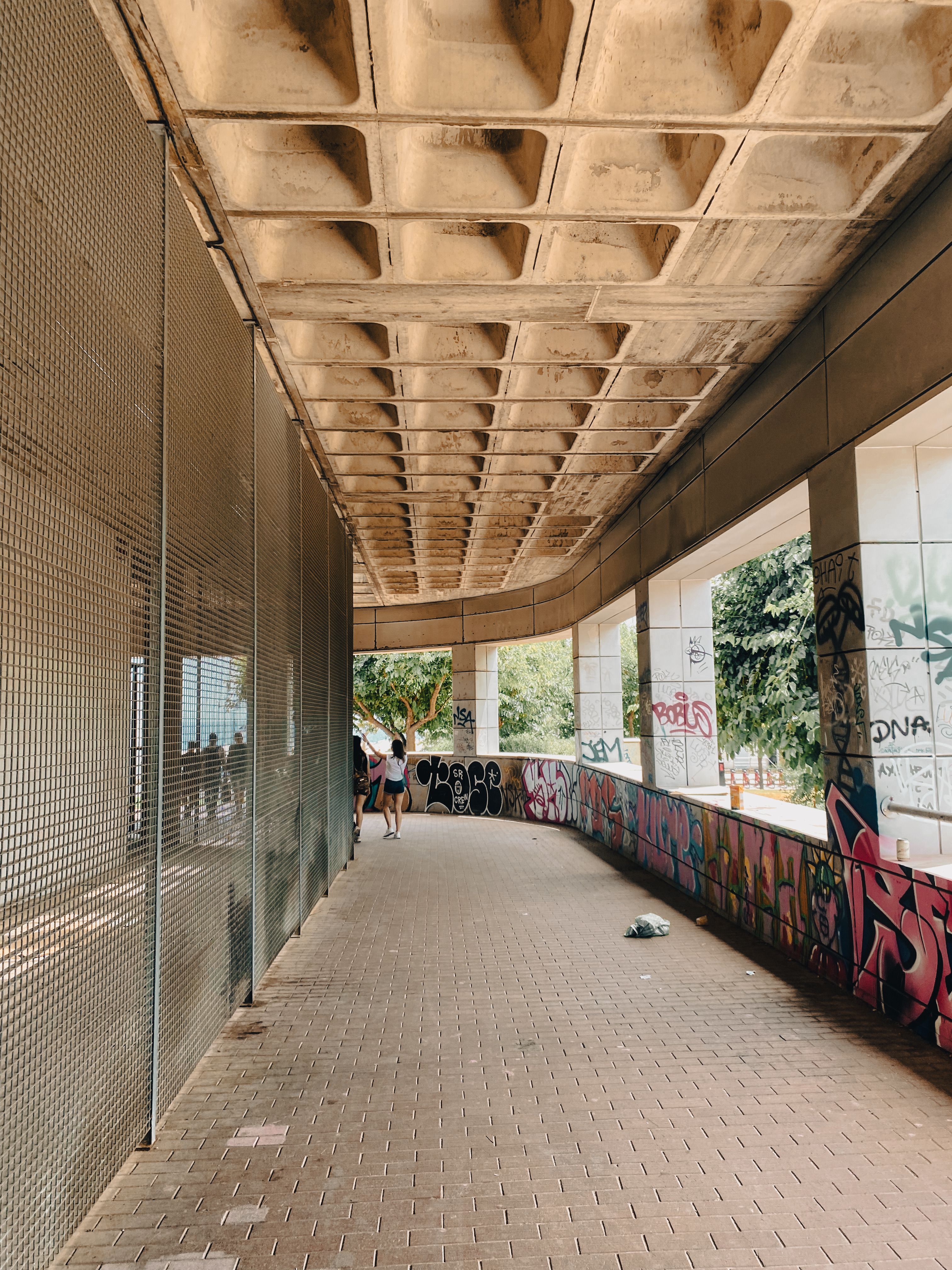 Gray Concrete Pathway of Building with Graffiti on Wall · Free Stock Photo