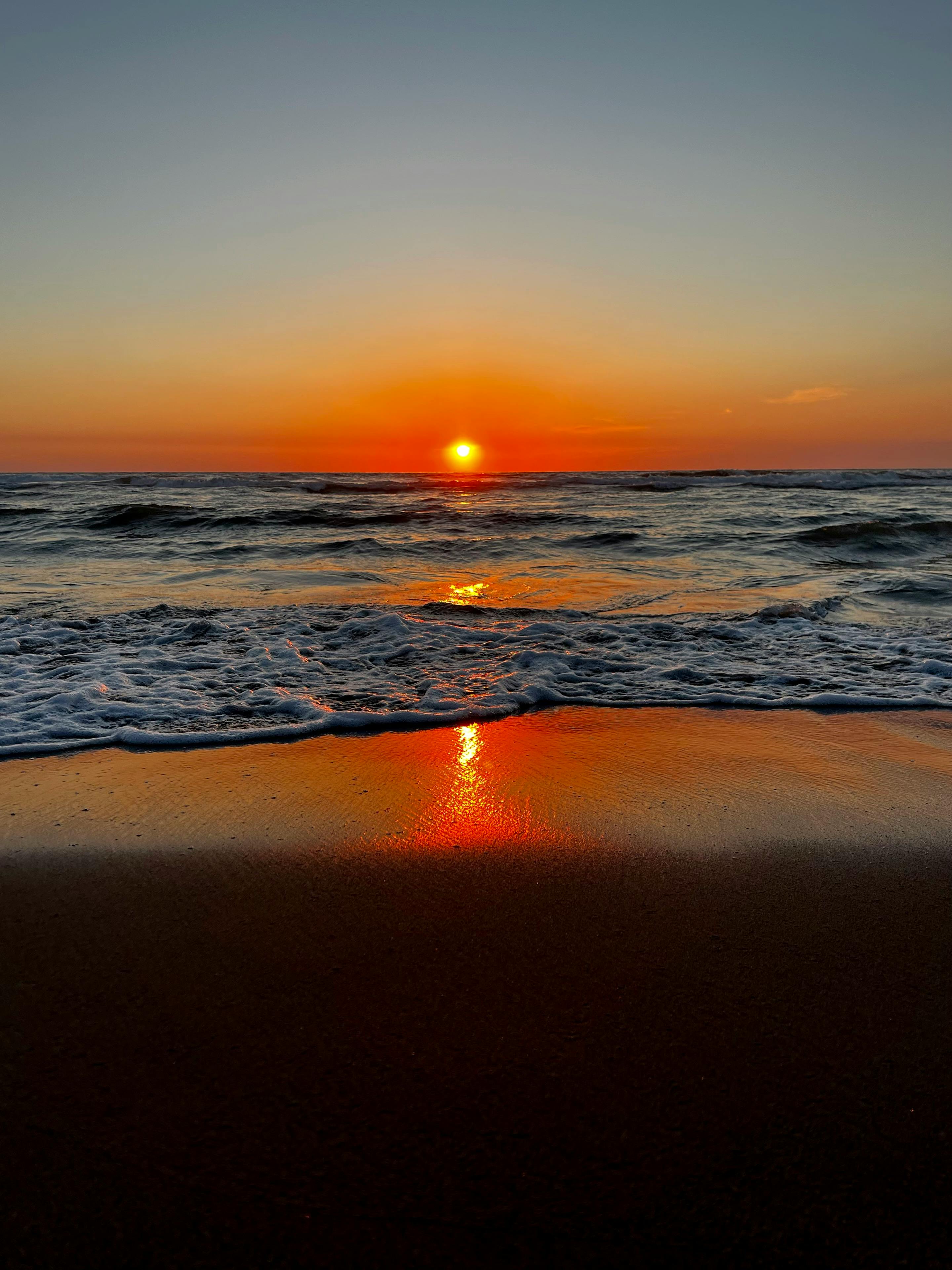 People Sitting on a Beach During Sunset · Free Stock Photo