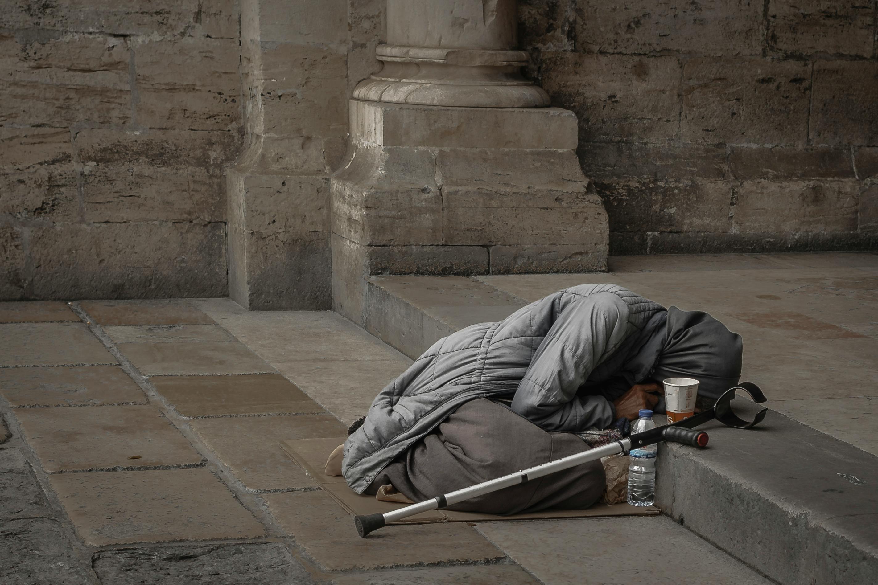 A Beggar Lying on the Floor · Free Stock Photo