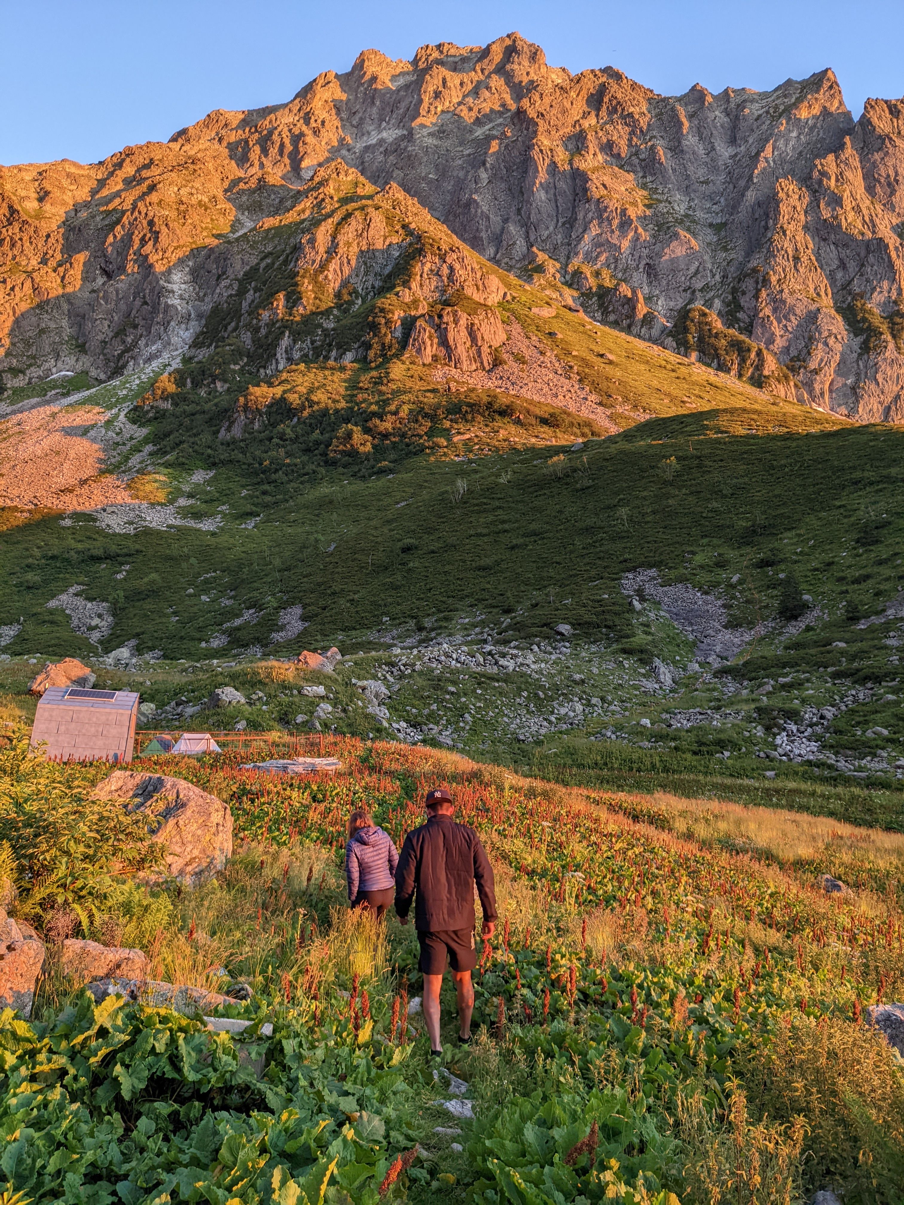 Two Hikers in a Scenery with Mountains · Free Stock Photo