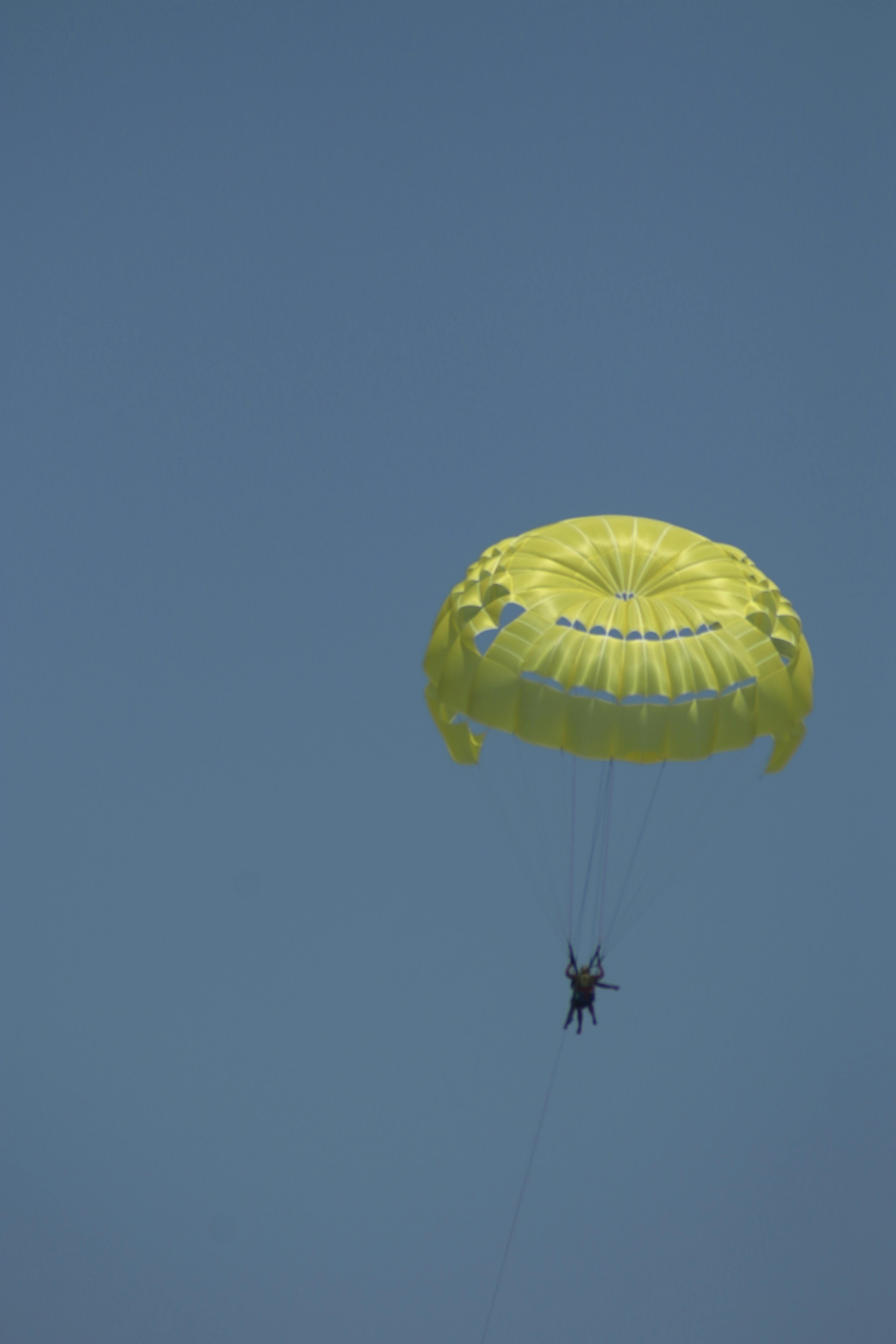 A Yellow Parachute in the Blue Sky · Free Stock Photo