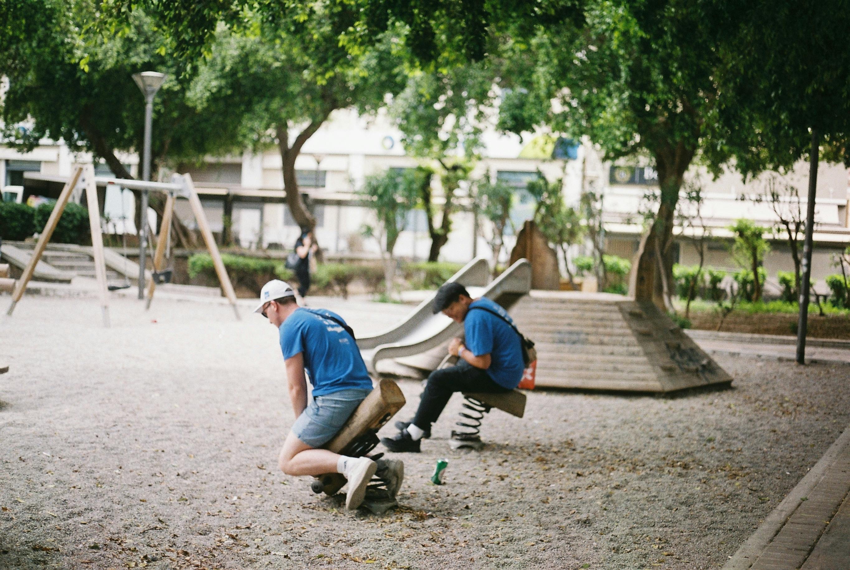 Men Playing on Children Playground · Free Stock Photo
