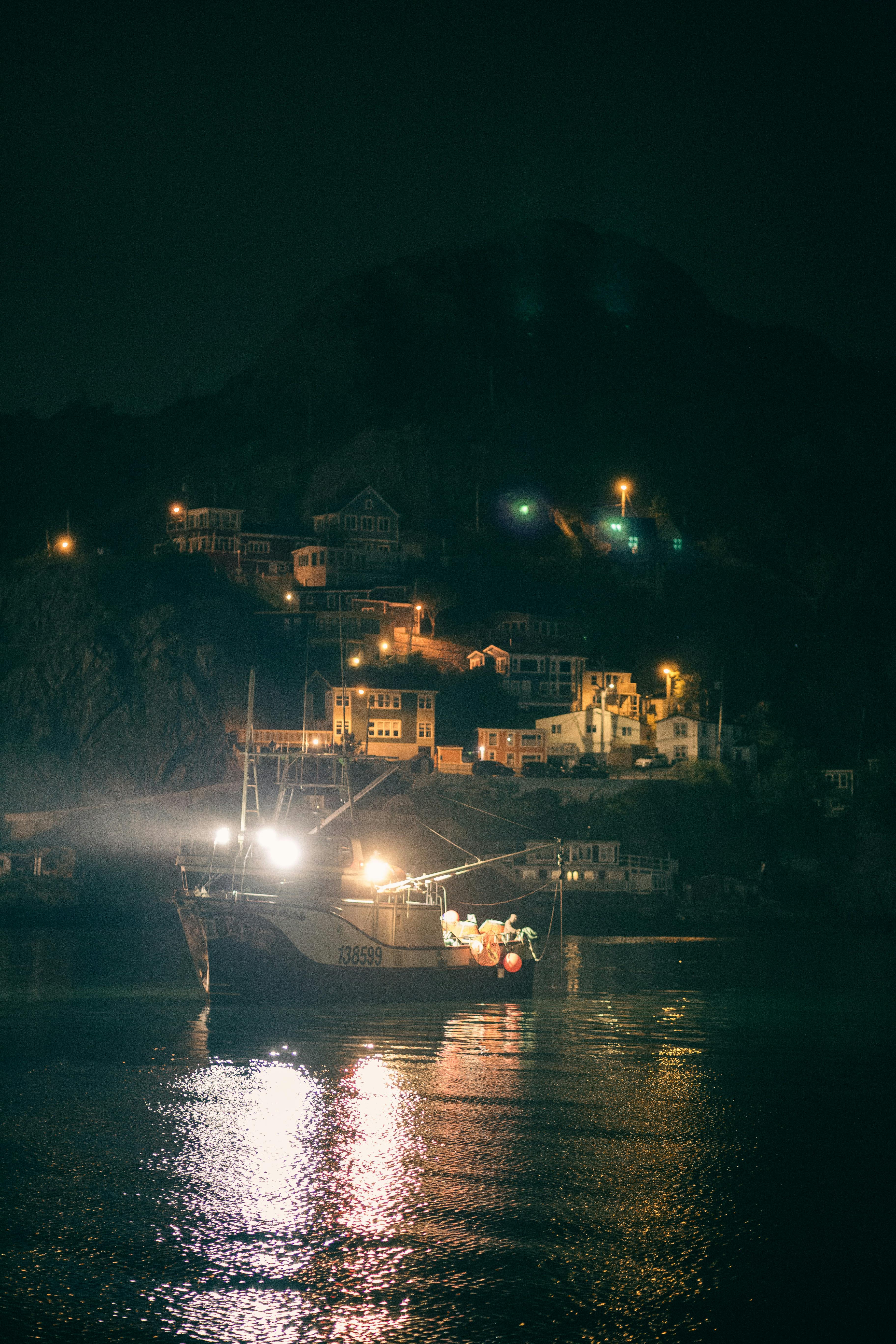 Boat with Lights in Water at Night · Free Stock Photo