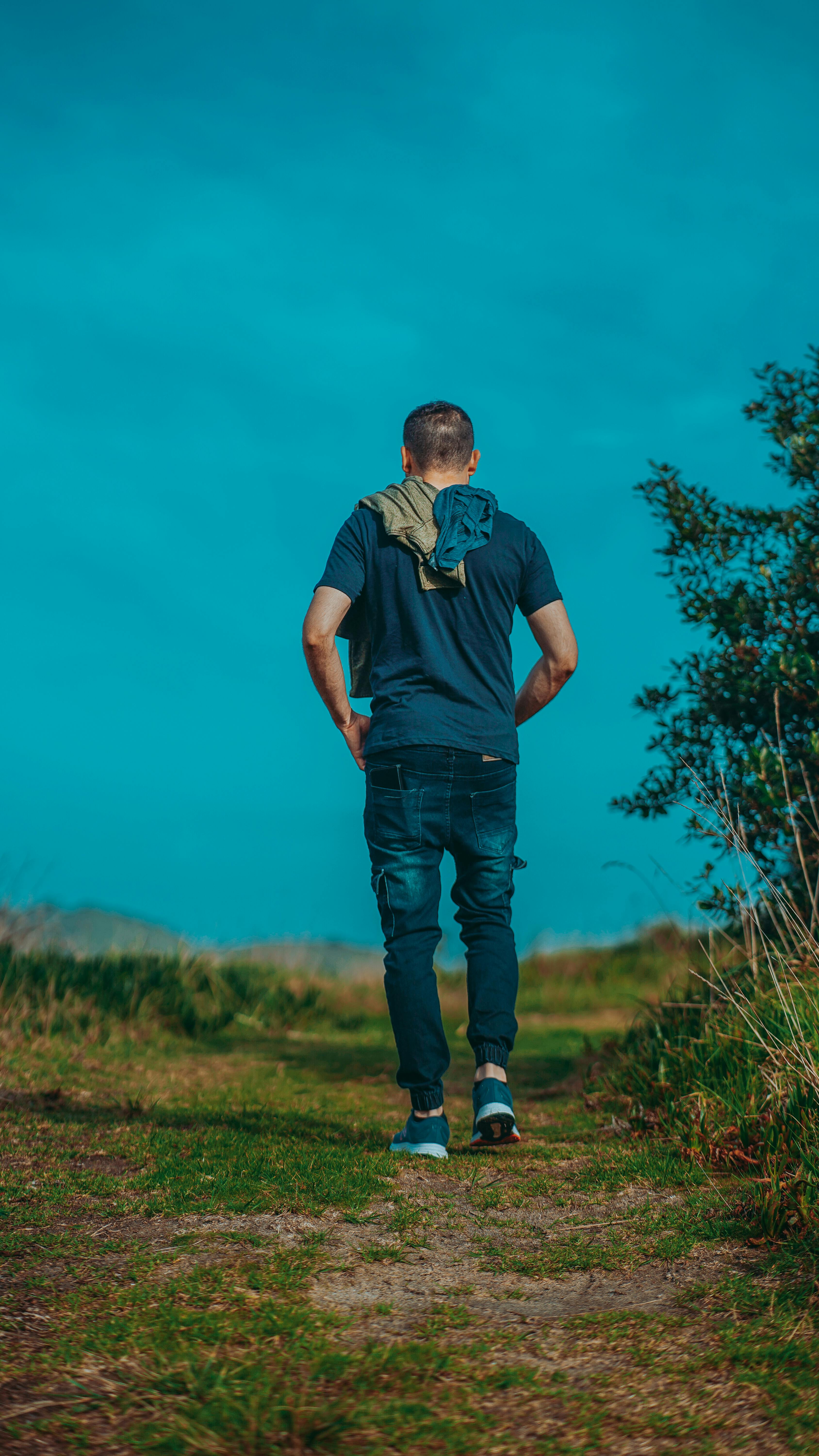 Back View of a Man Wearing Blue Denim Jeans · Free Stock Photo