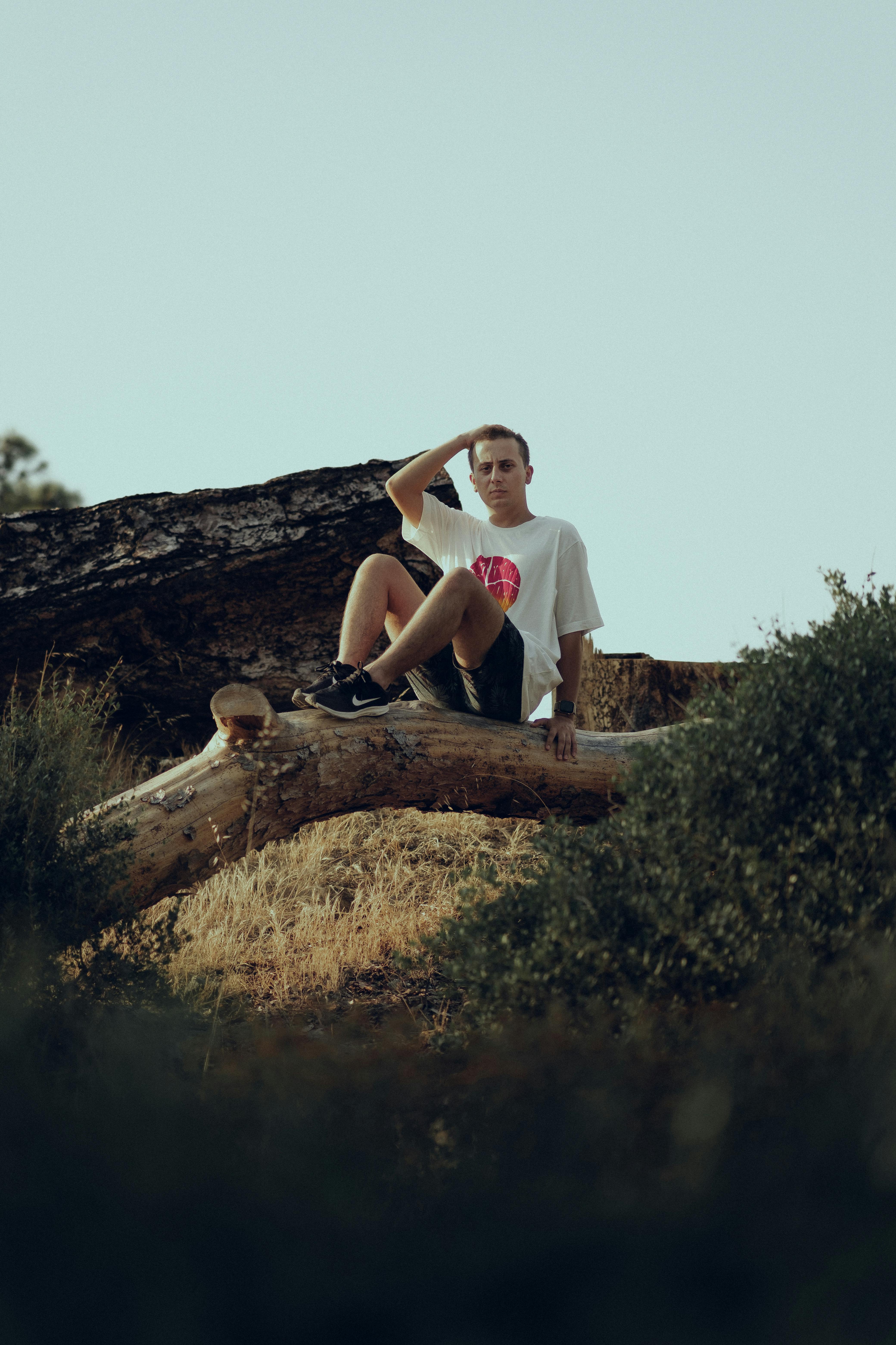 Man Sitting on Bough · Free Stock Photo