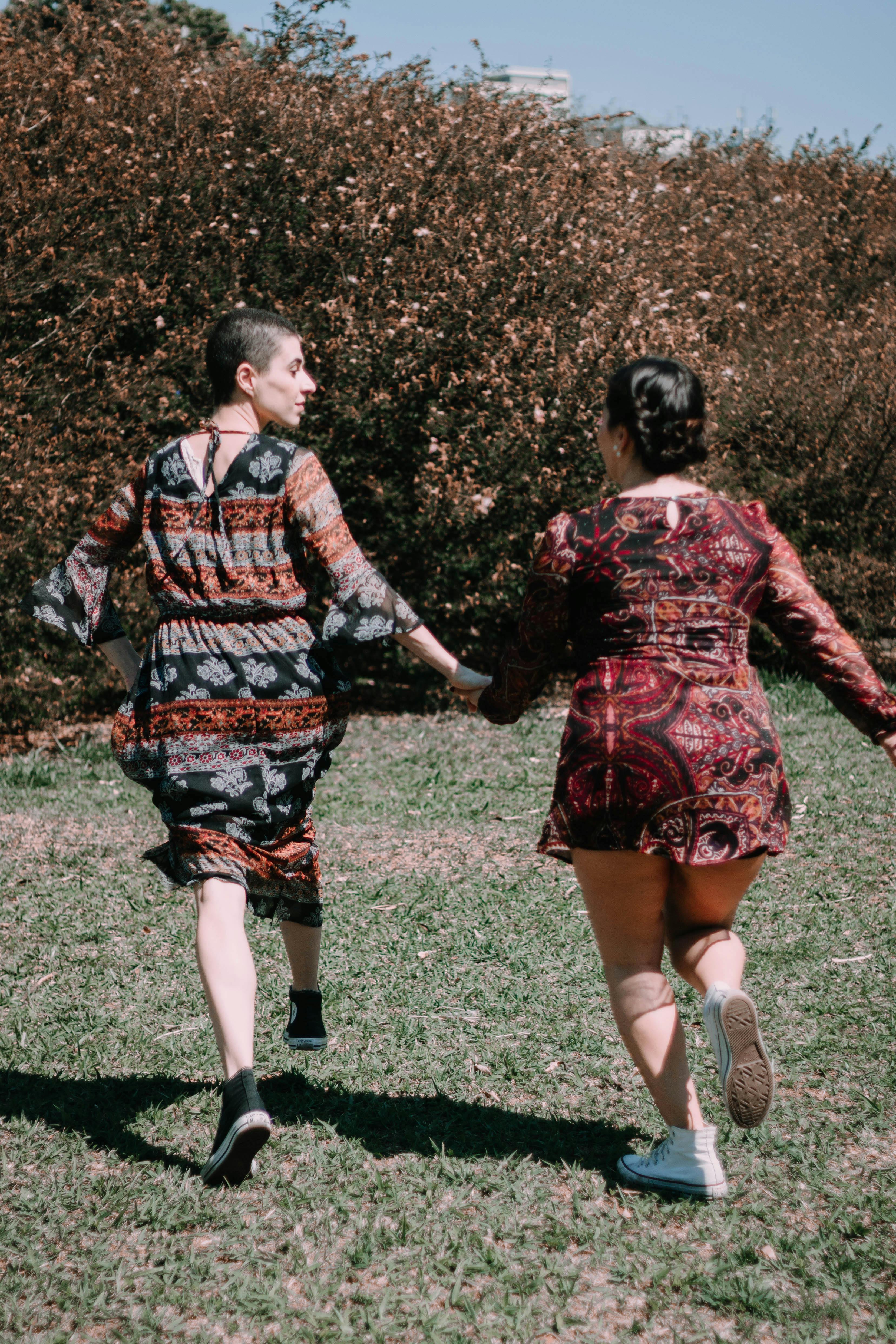 Women Holding Hands While Running · Free Stock Photo