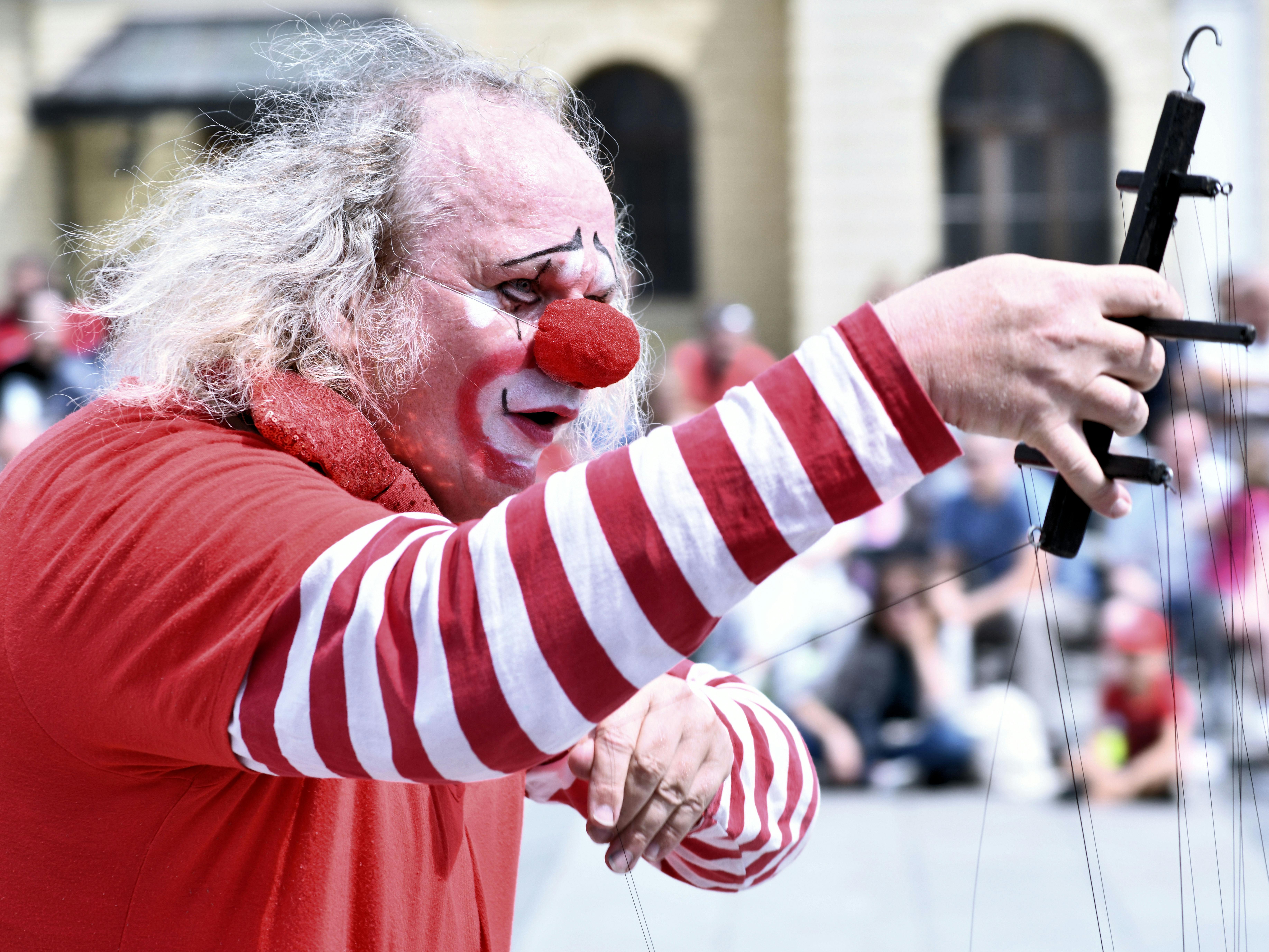 Close Up Shot of a Clown Performing on the Street · Free Stock Photo