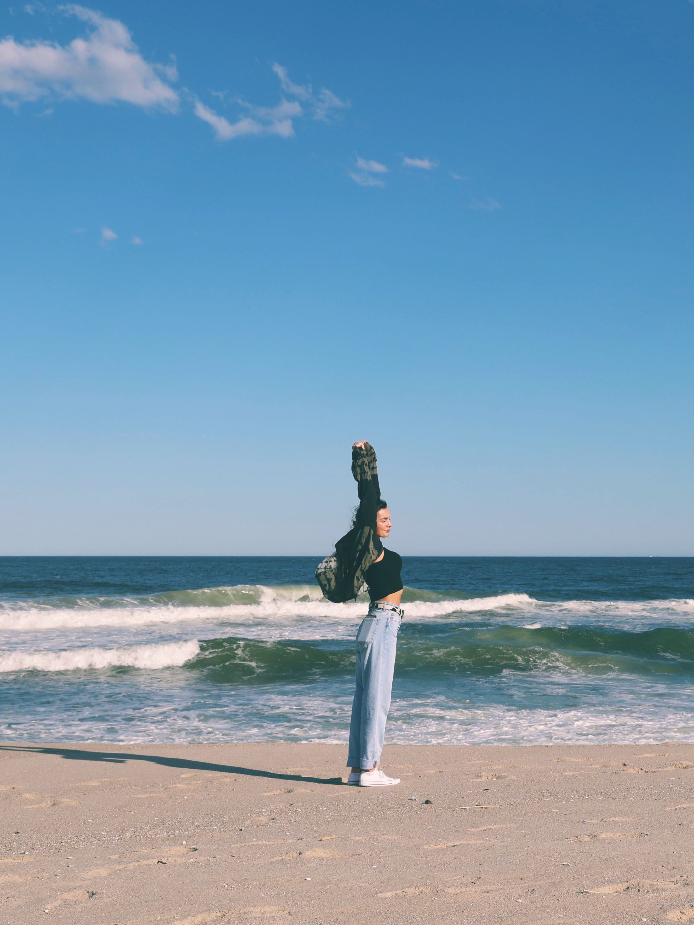 Woman Standing on the Sea Shore · Free Stock Photo