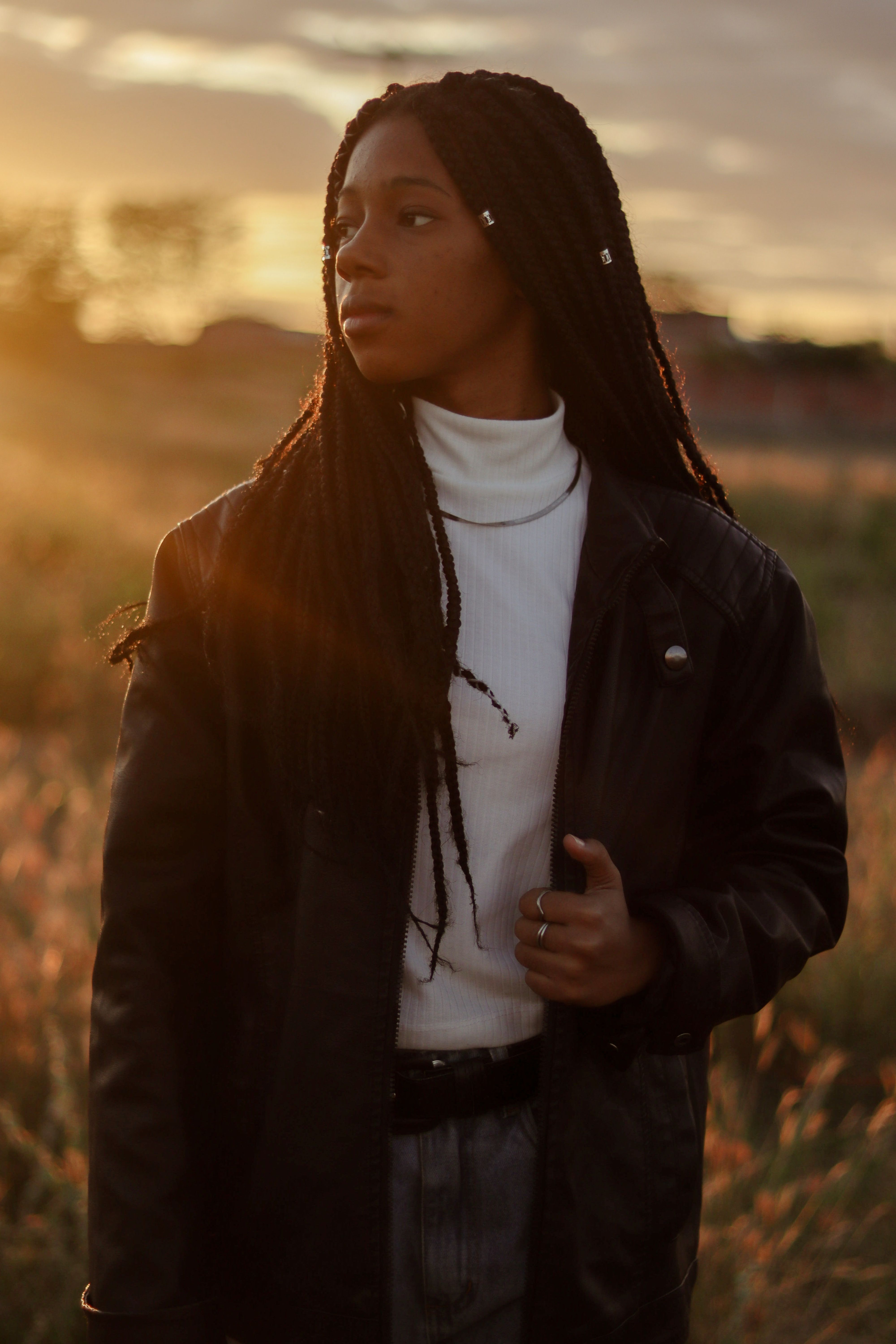 Woman in Black Leather Jacket Covering Her Eye · Free Stock Photo
