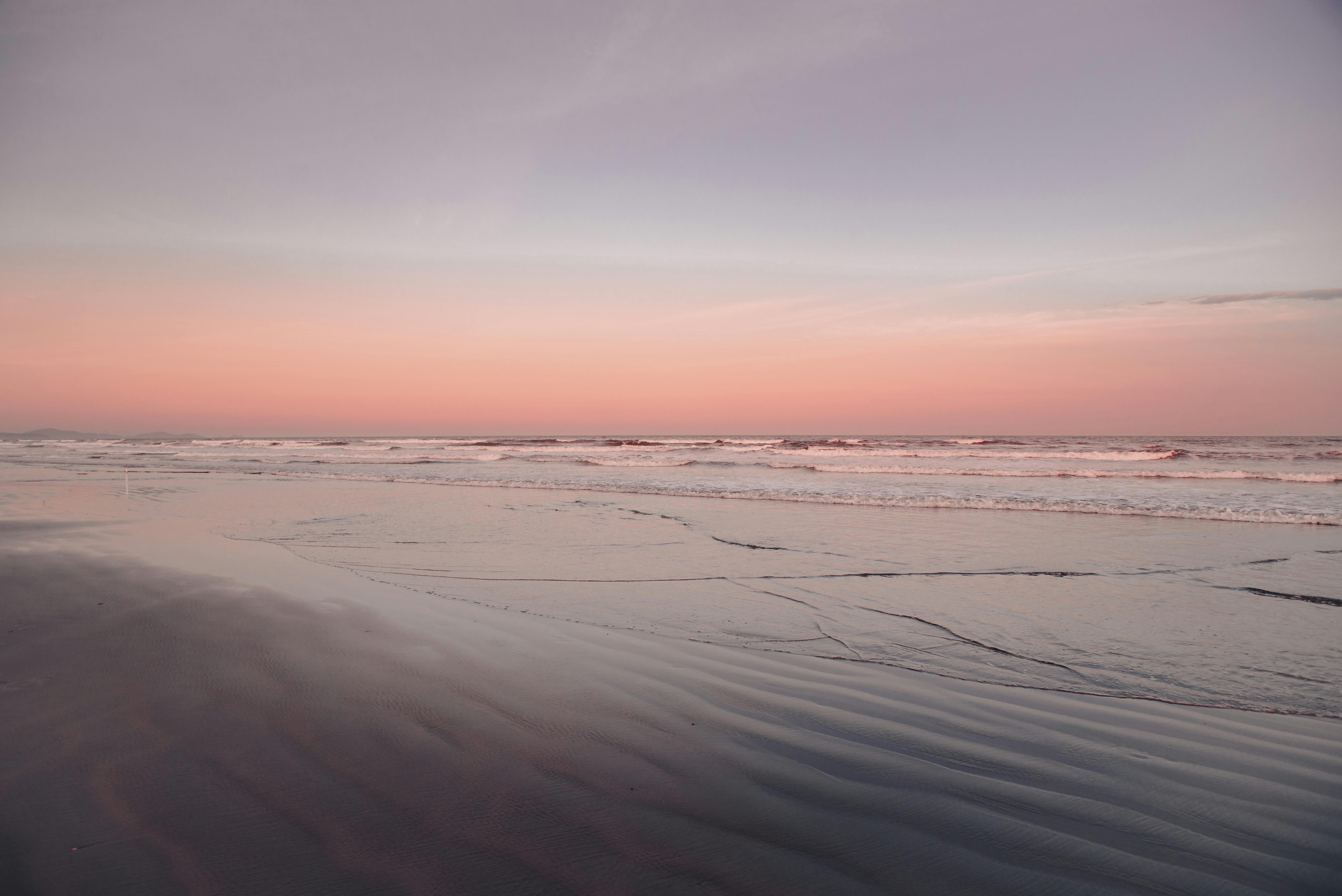 Woman Standing on Seashore · Free Stock Photo