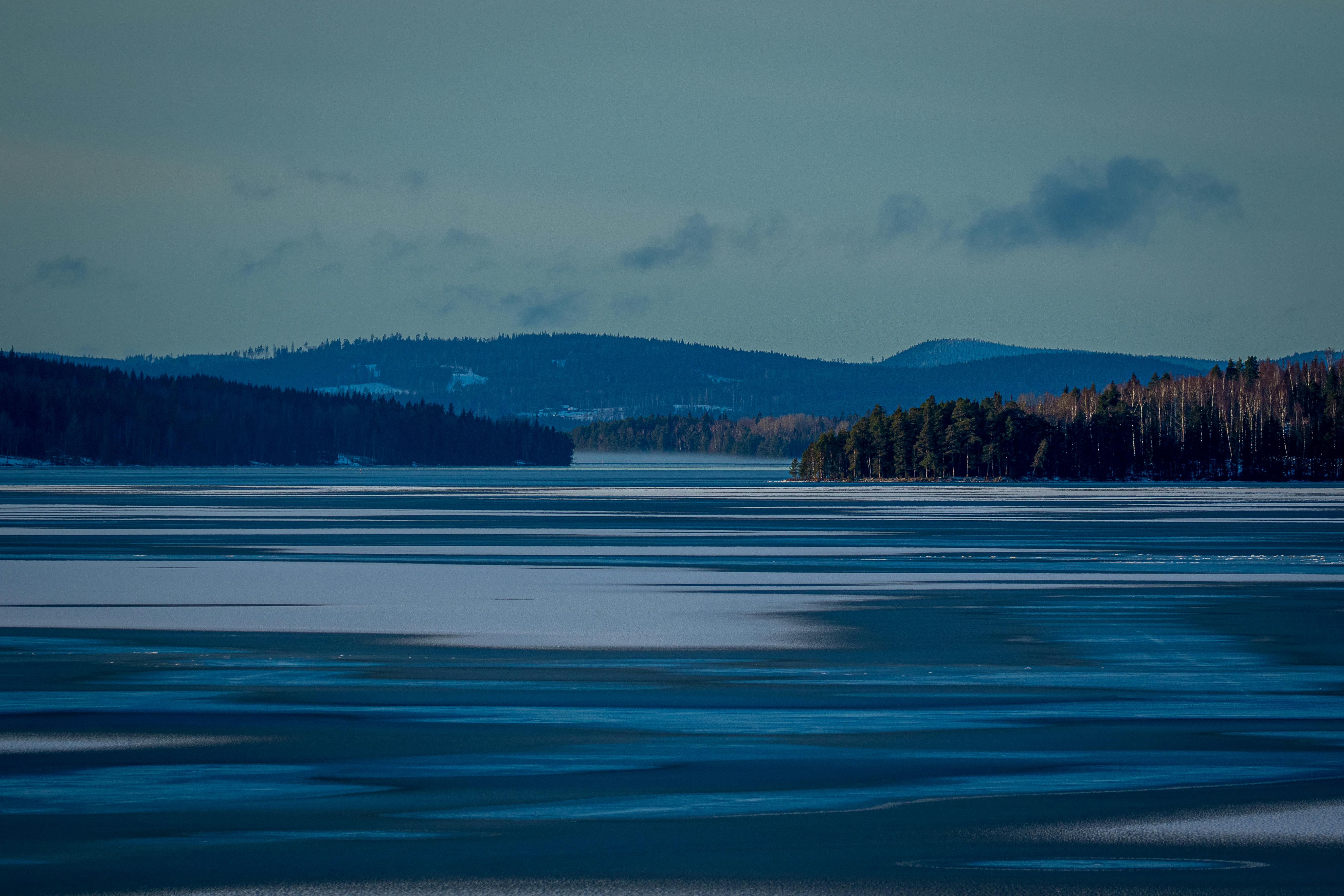 Blue Ocean and Mountains under the Sky · Free Stock Photo