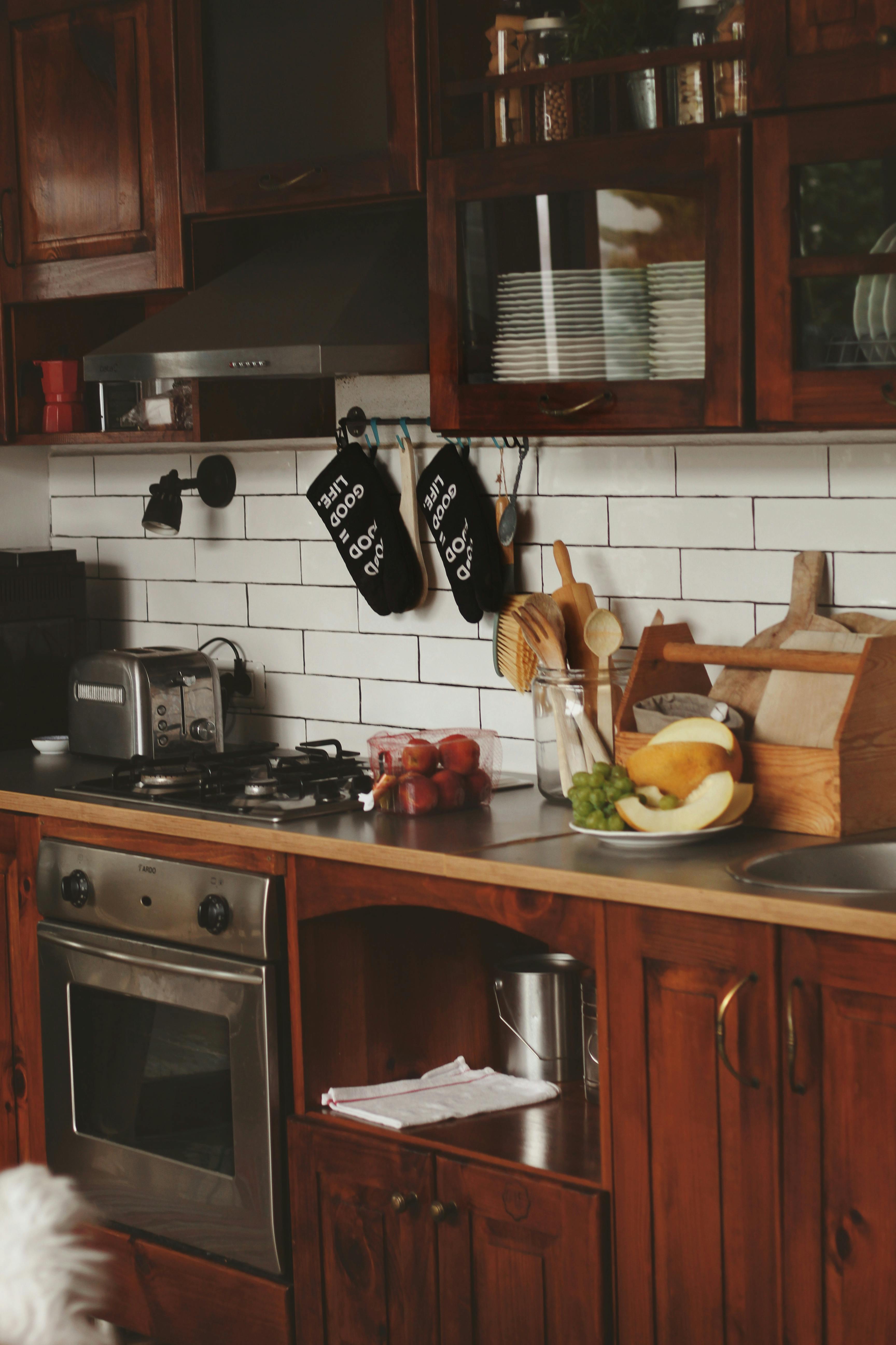 Photo of a Kitchen Counter with Kitchen Tools, an Oven, a Toaster, an ...