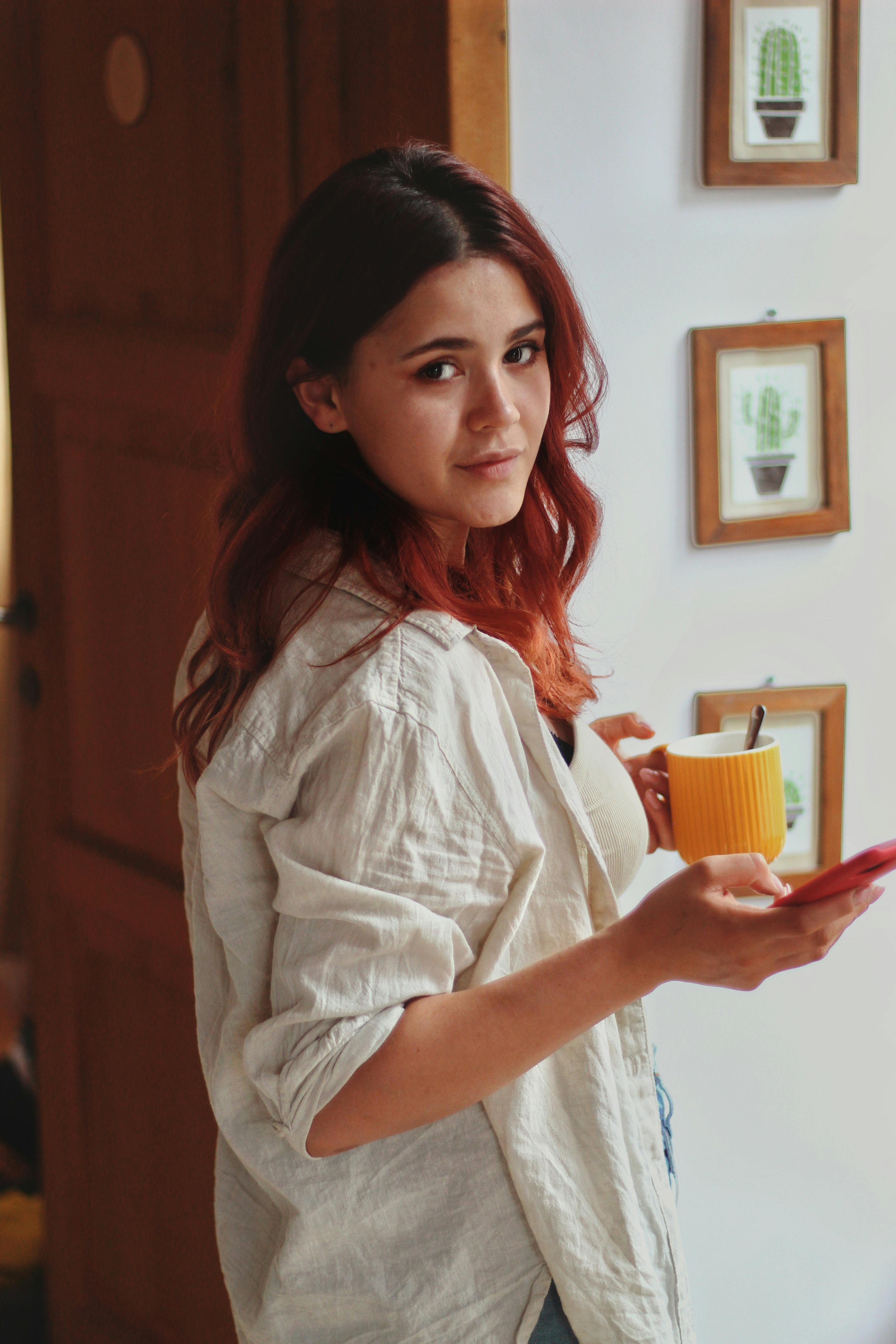 Woman Sitting on the Floor Drinking Coffee · Free Stock Photo