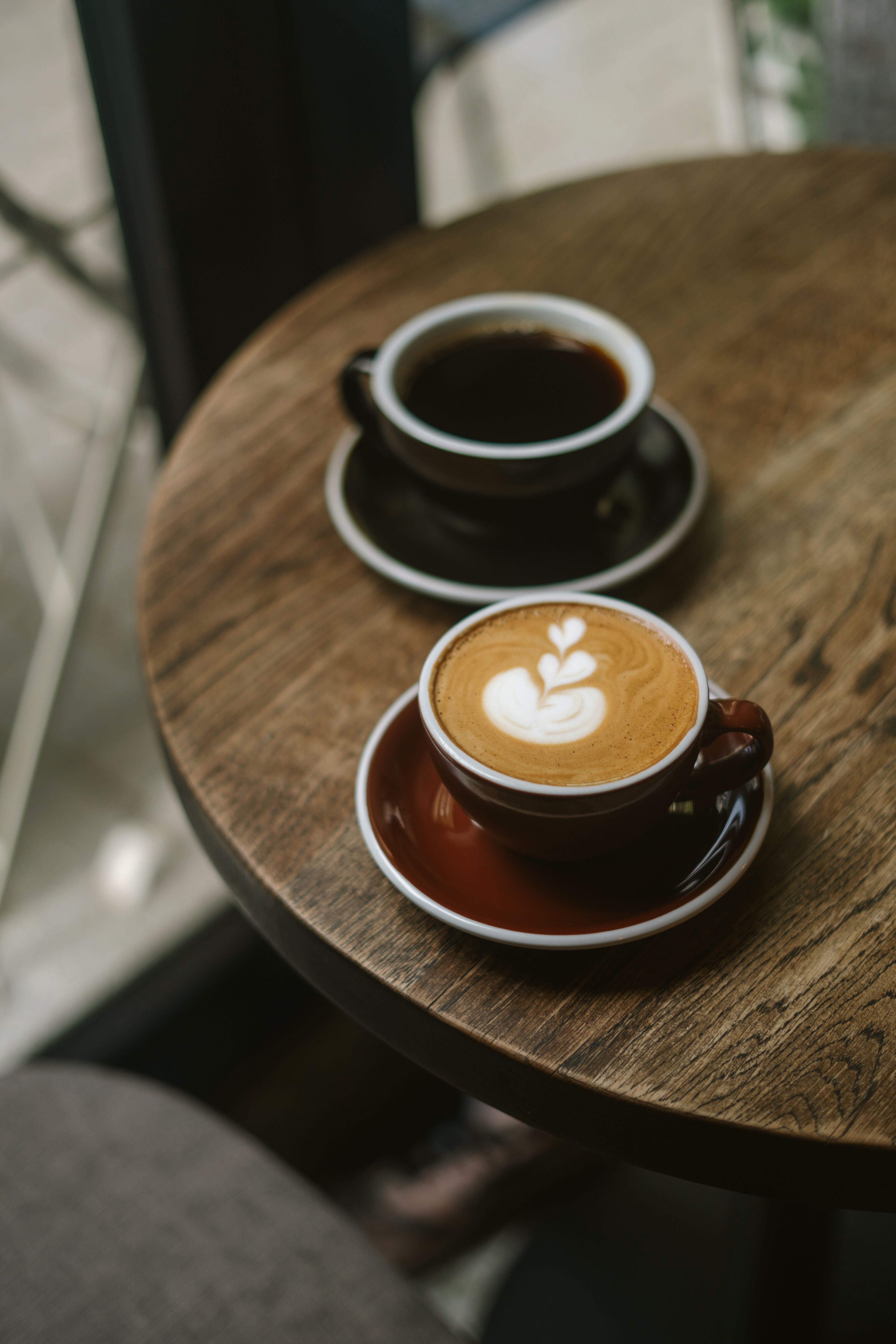 Two Cups of Coffee on Brown Wooden Table · Free Stock Photo