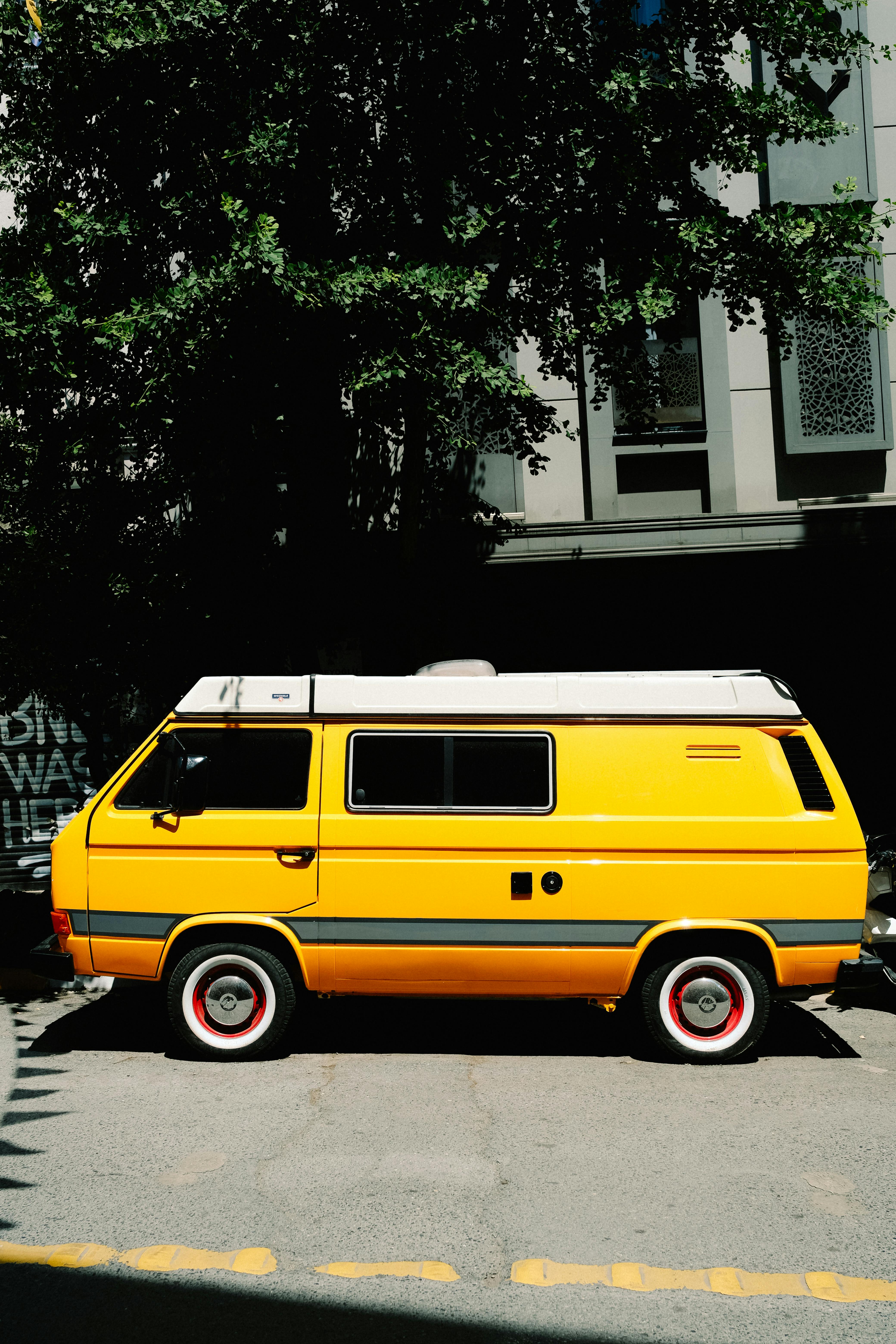 Side View of a Parked Yellow Van · Free Stock Photo