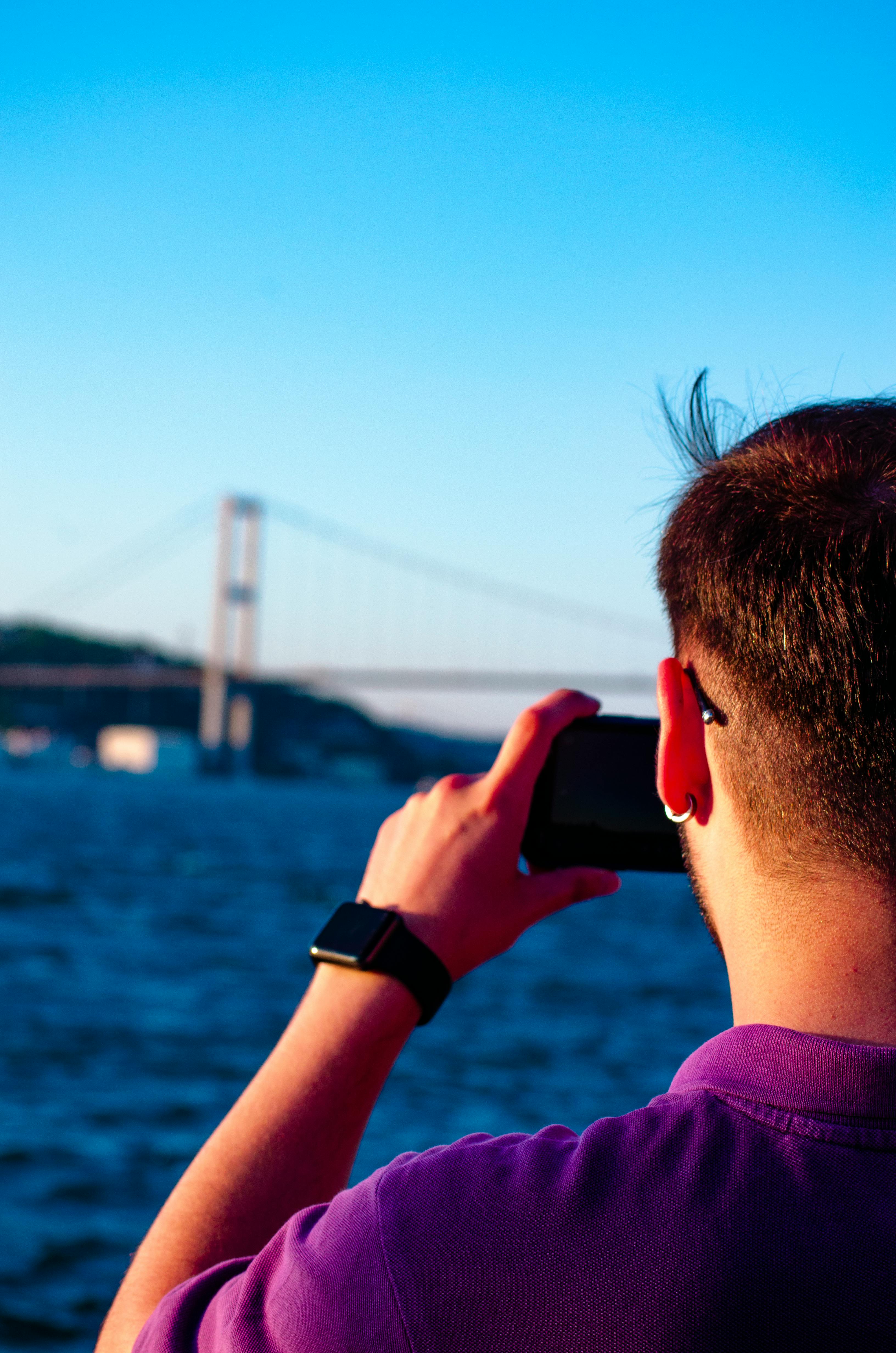 Man Taking Photo with a Cellphone · Free Stock Photo