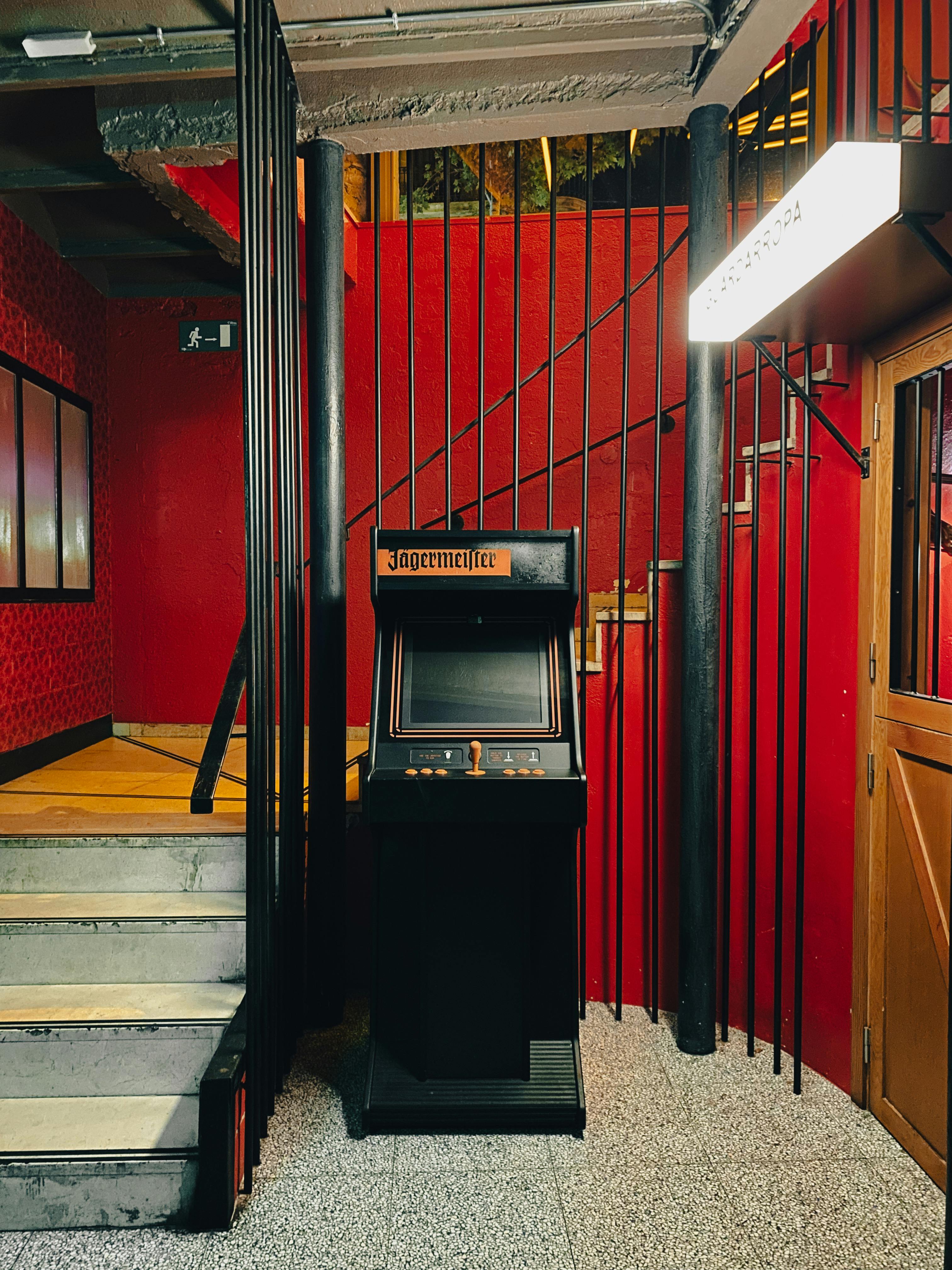 A Vintage Video Gaming Machine Below the Staircase · Free Stock Photo