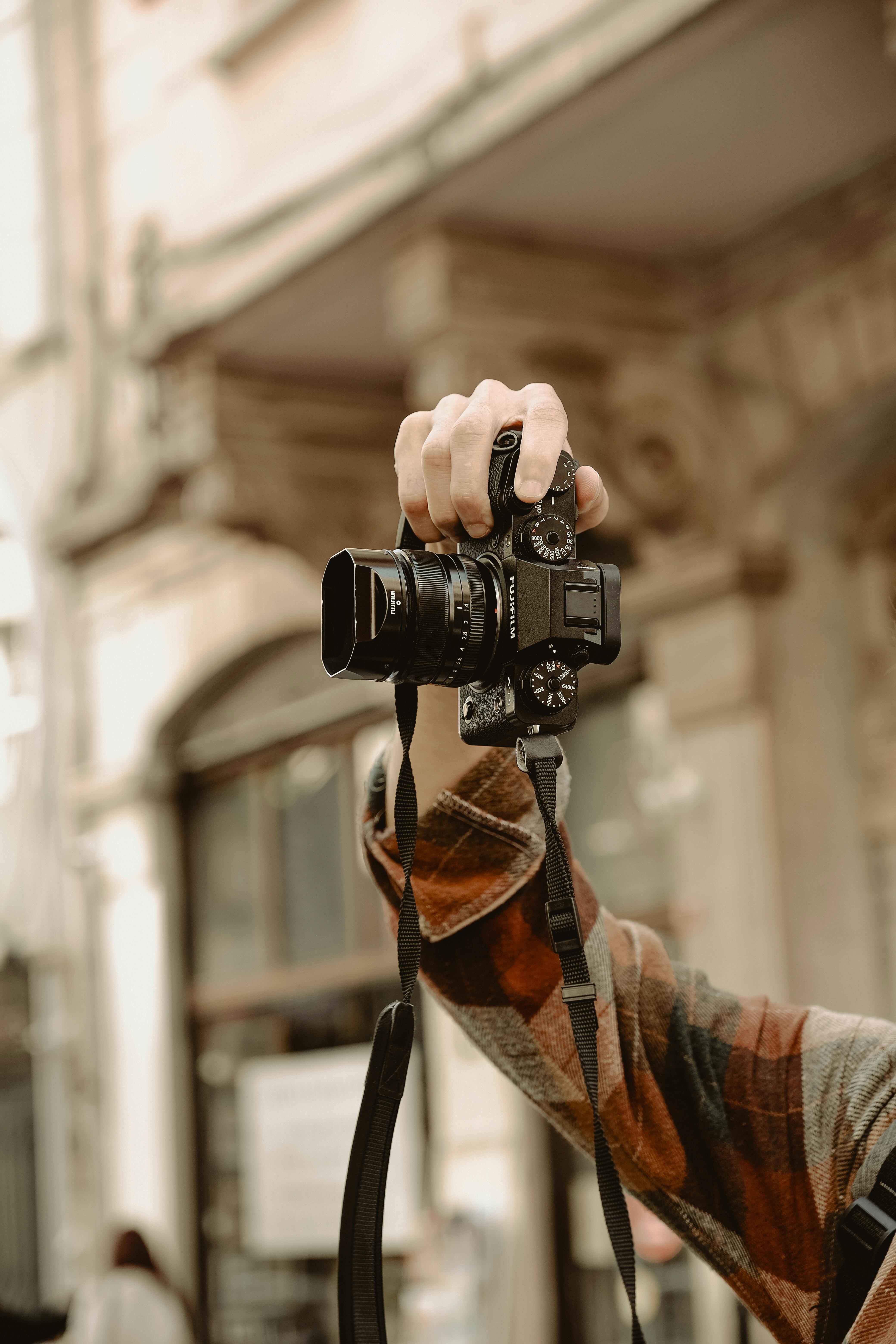 A Person Holding a Camera · Free Stock Photo