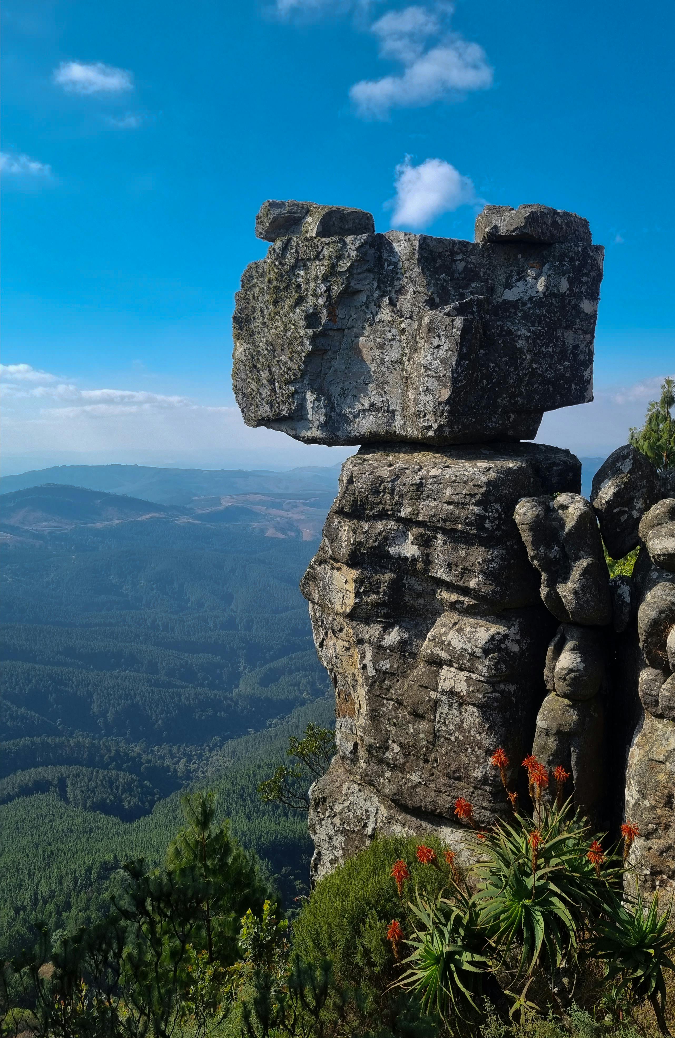 Aerial View of Gray Rock Formation on Under Blue Sky · Free Stock Photo