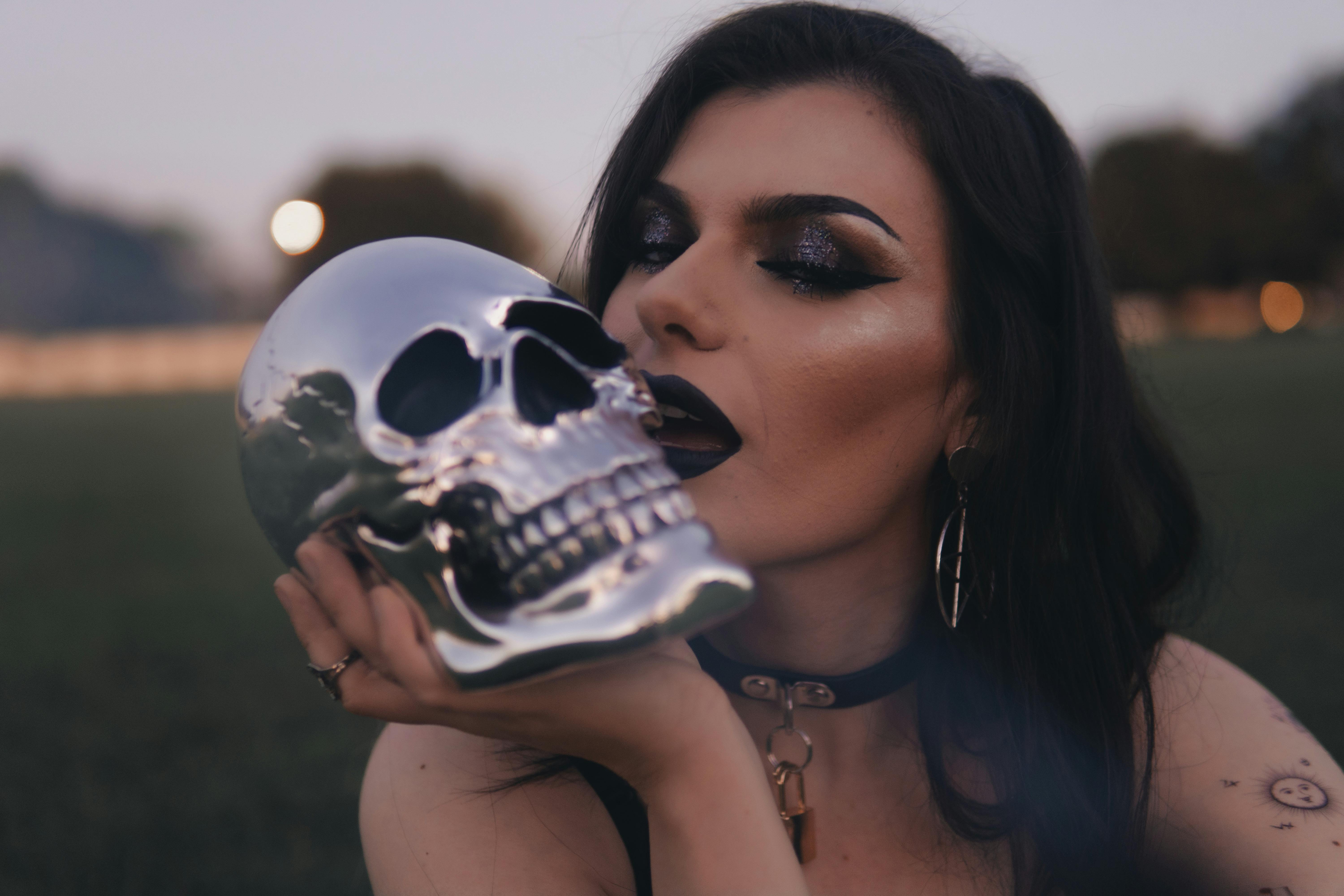 A Woman Holding a Skull · Free Stock Photo