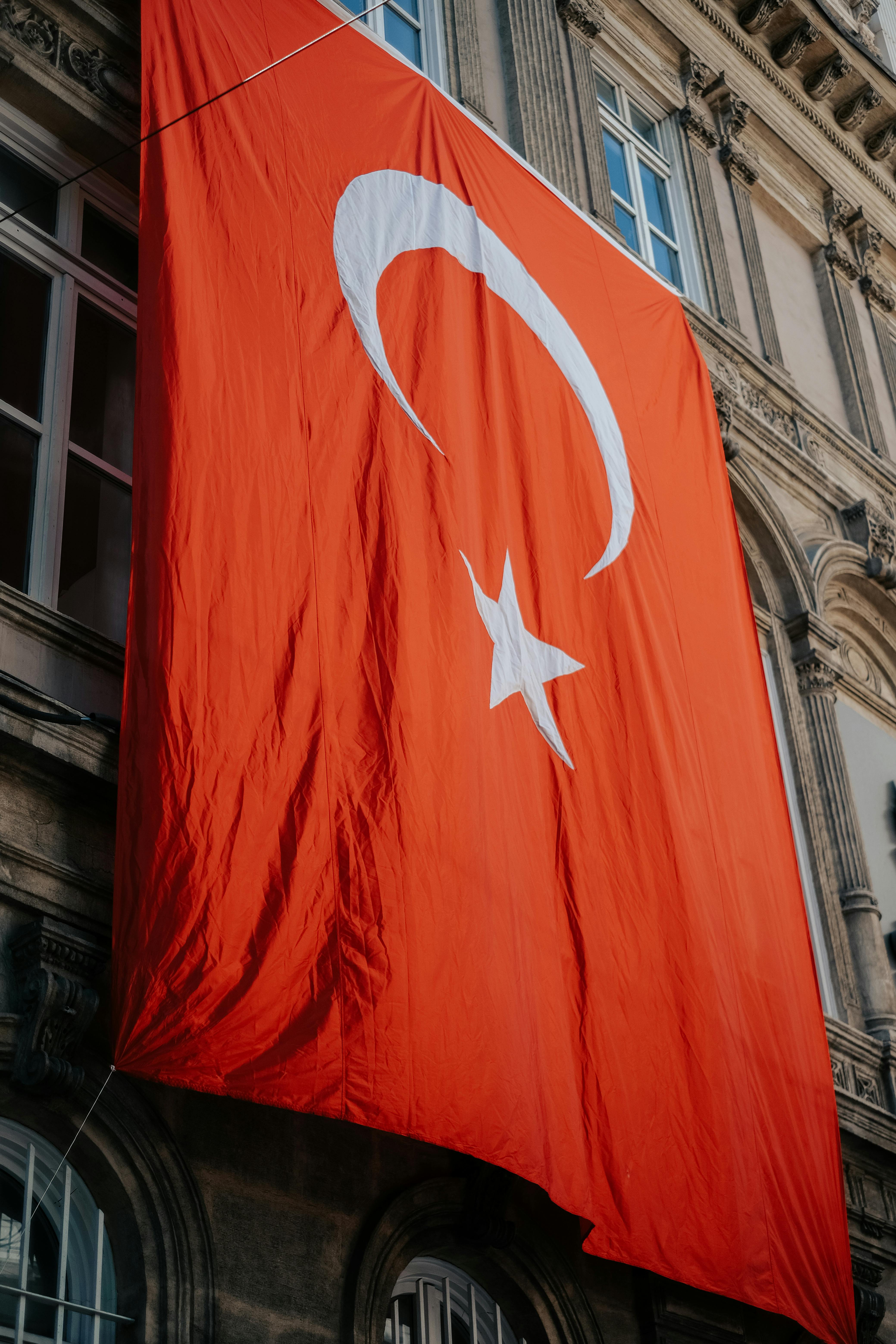 Turkish Flag Hanging on a Building · Free Stock Photo
