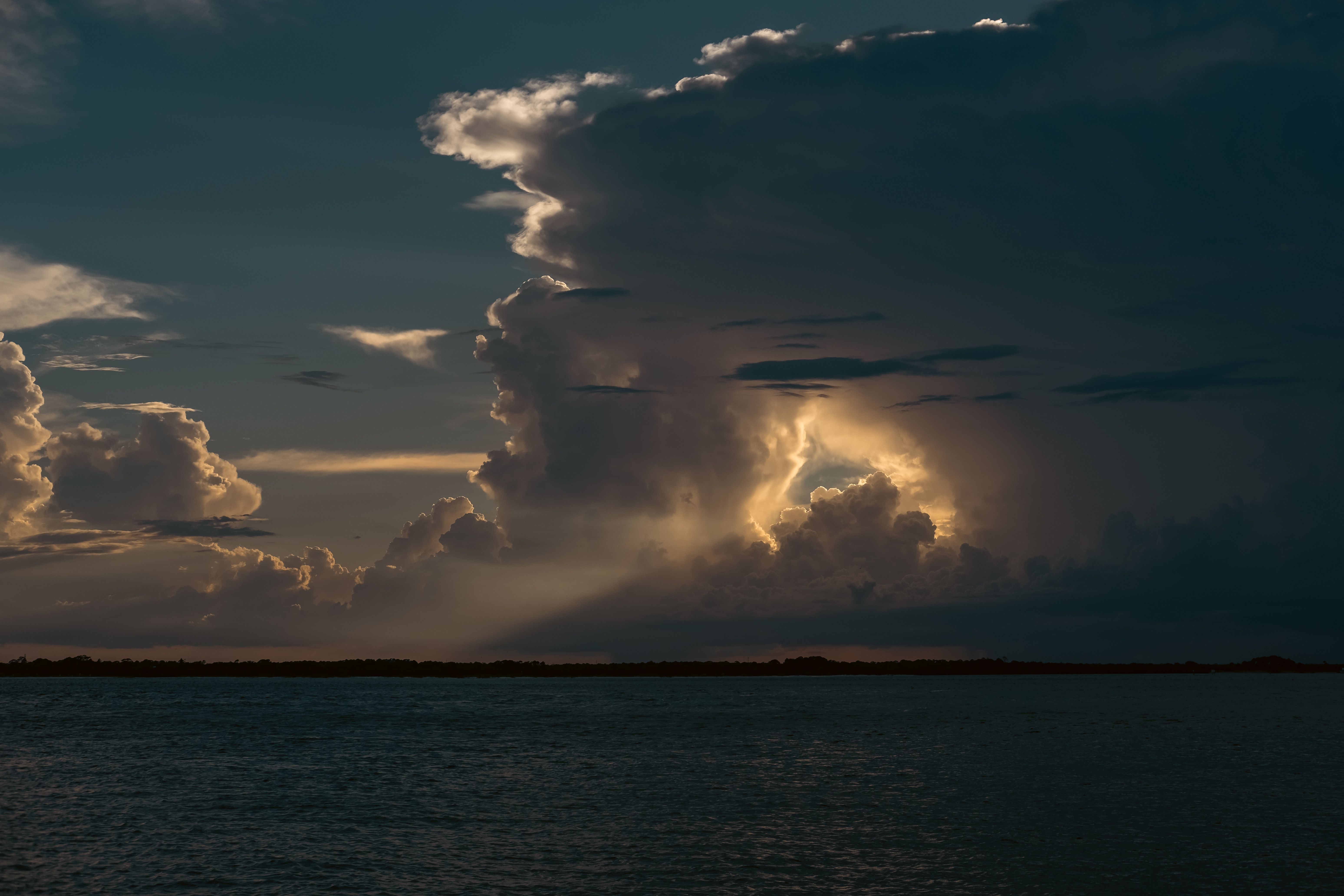 Body of Water Under Cloudy Sky · Free Stock Photo