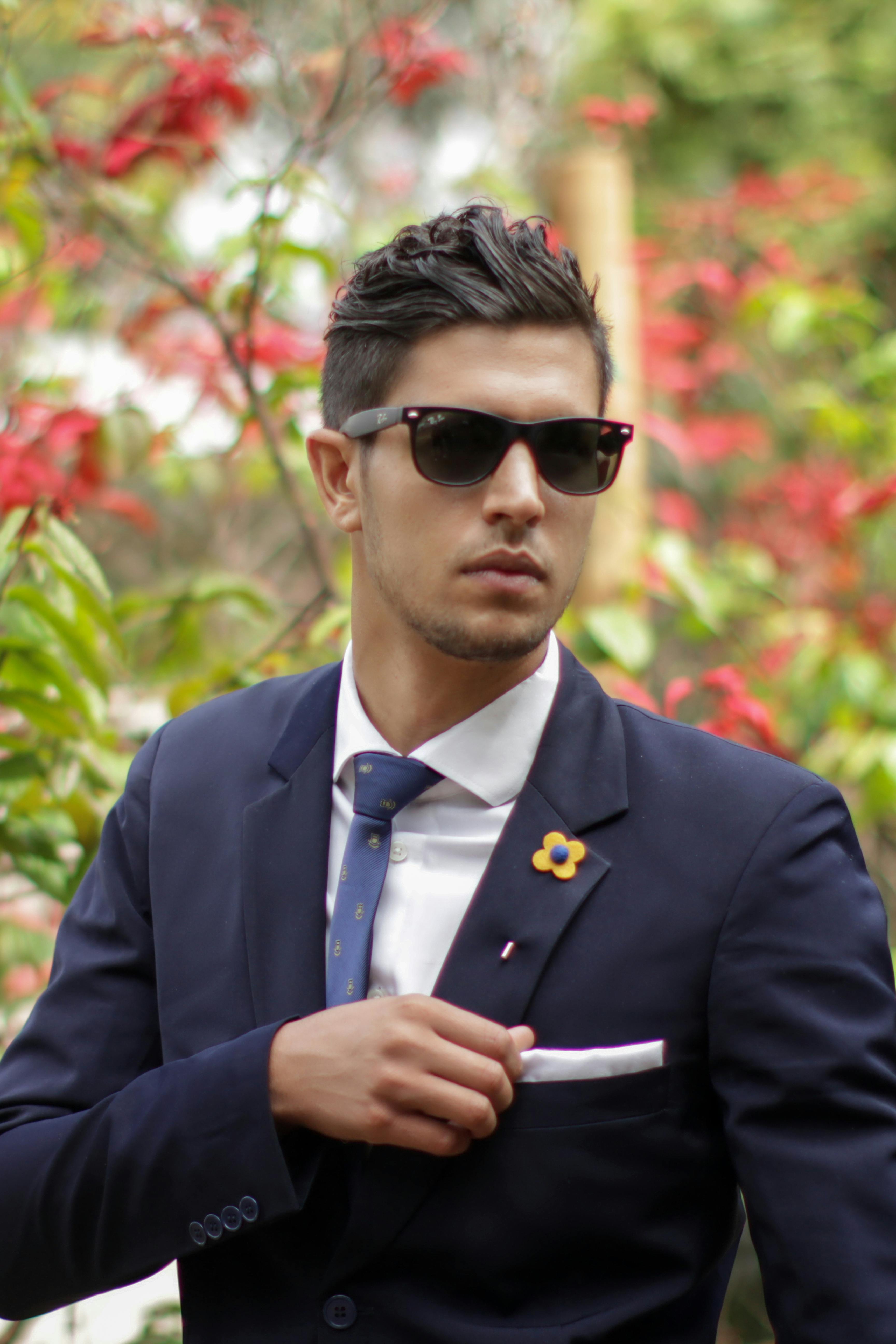 A Man Holding Suit Jacket over His Shoulder · Free Stock Photo