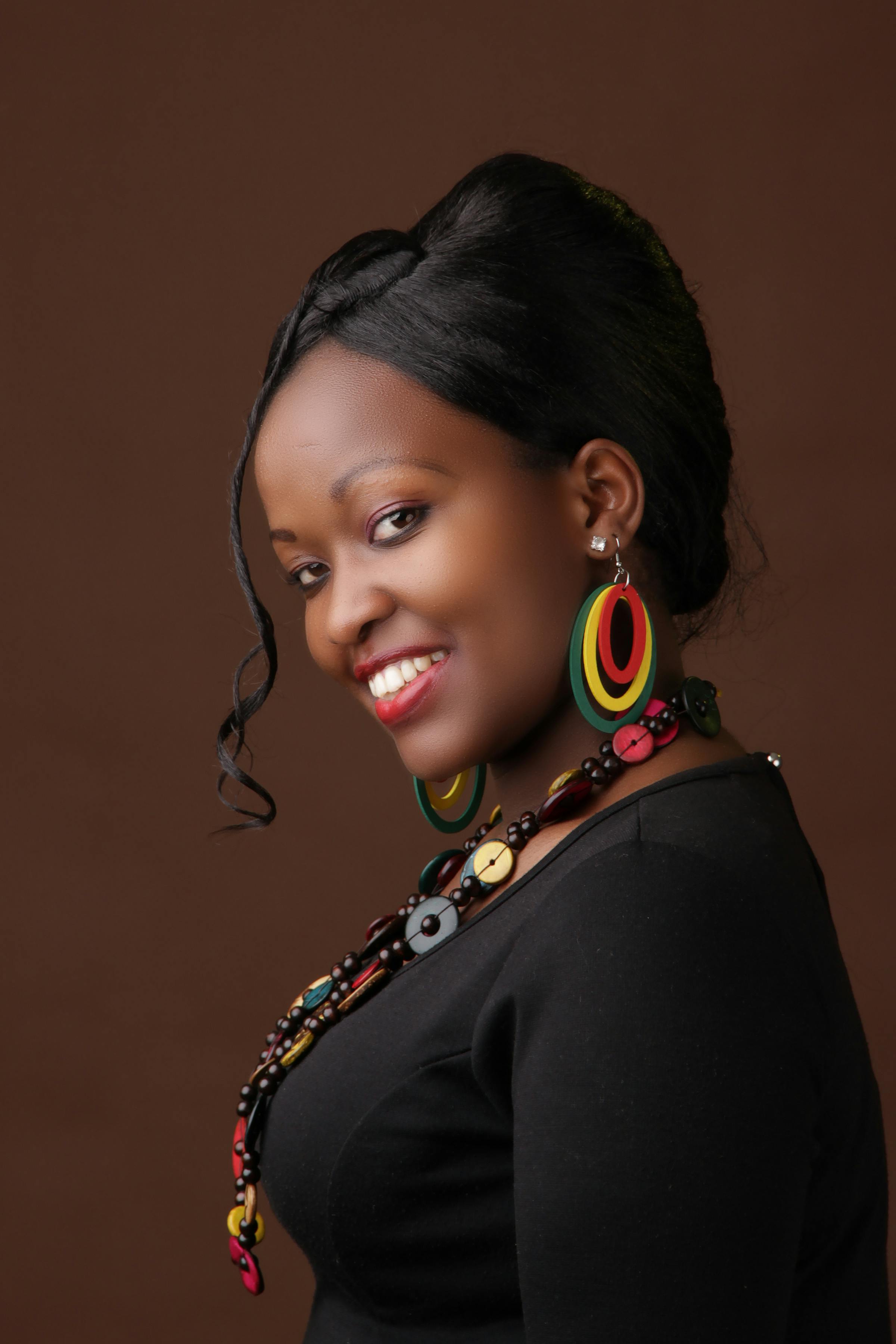 Woman with Curly Hair Wearing Gold Earrings and Gold Necklaces · Free ...