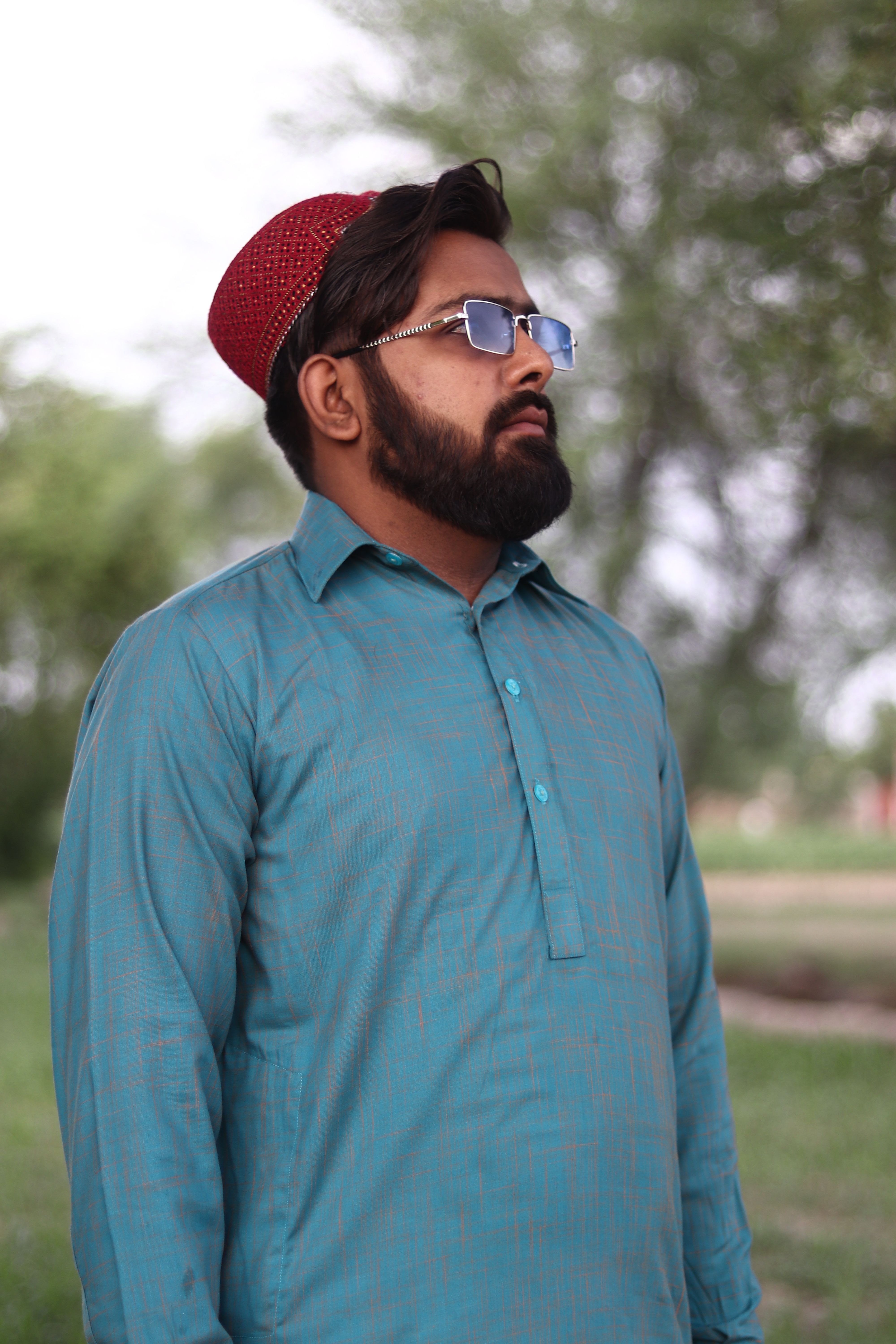 Photograph of a Man with a Red Taqiyah · Free Stock Photo