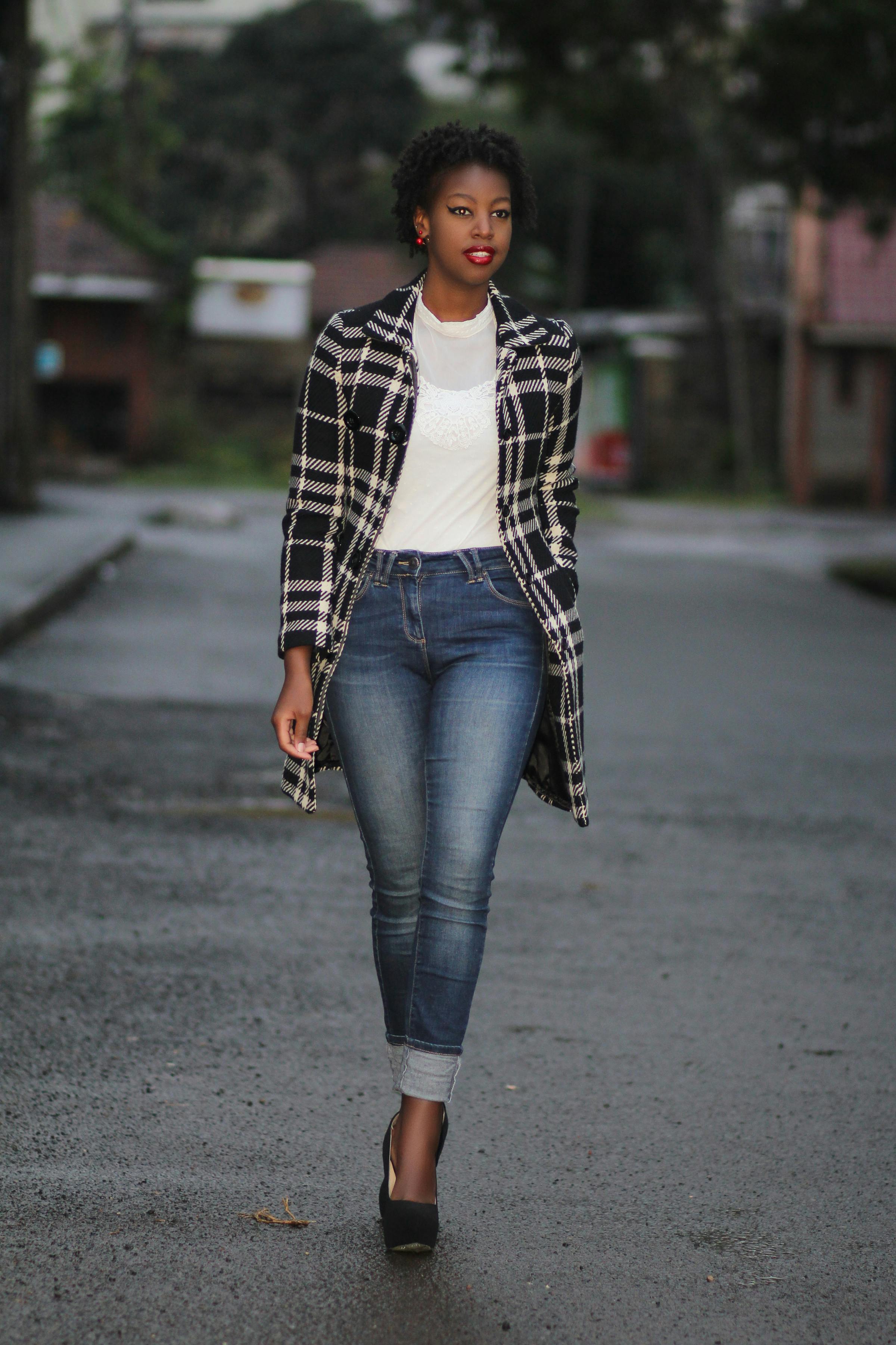 Photo of a Woman in a Black and White Checked Coat · Free Stock Photo