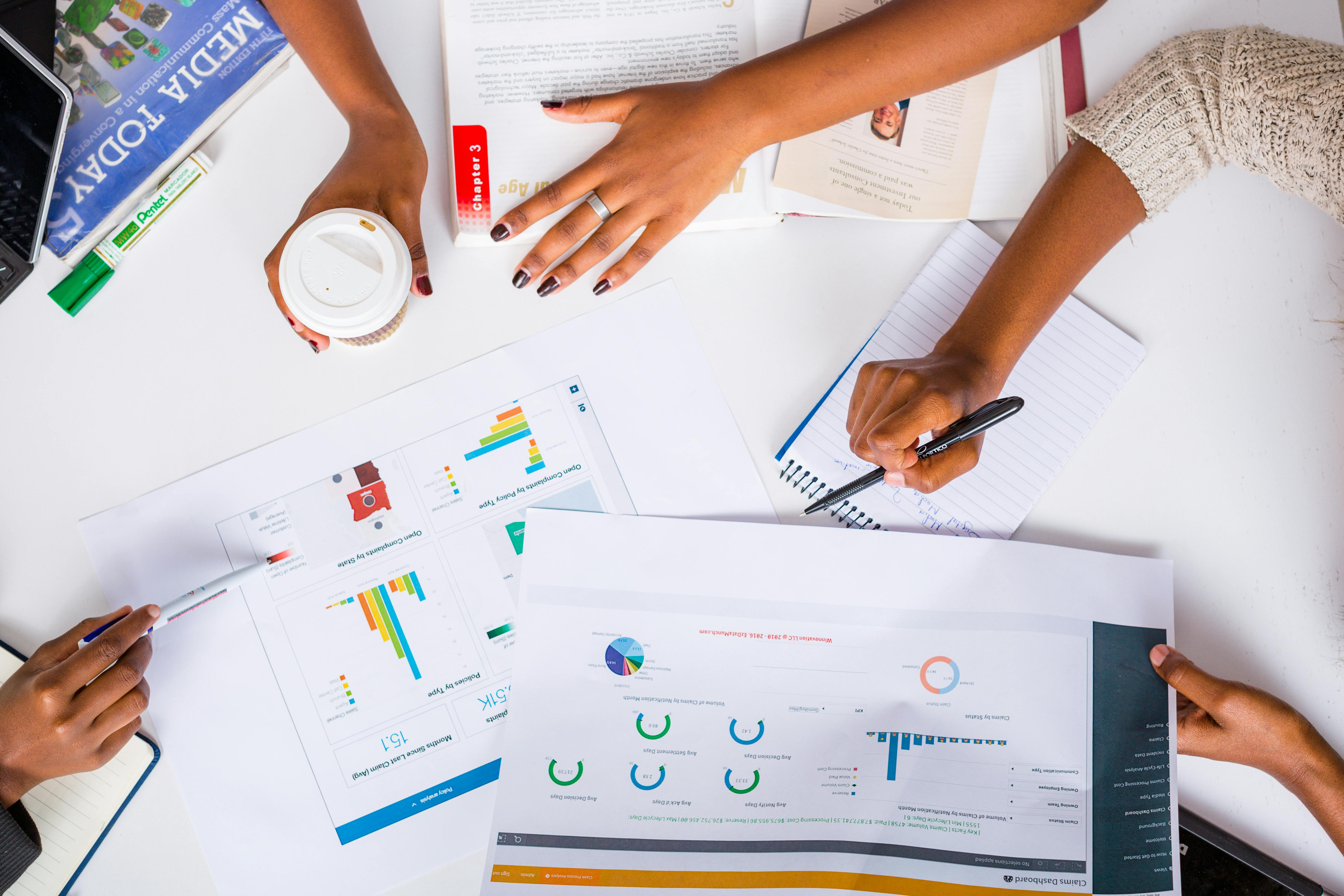 Notebook and Charts · Free Stock Photo