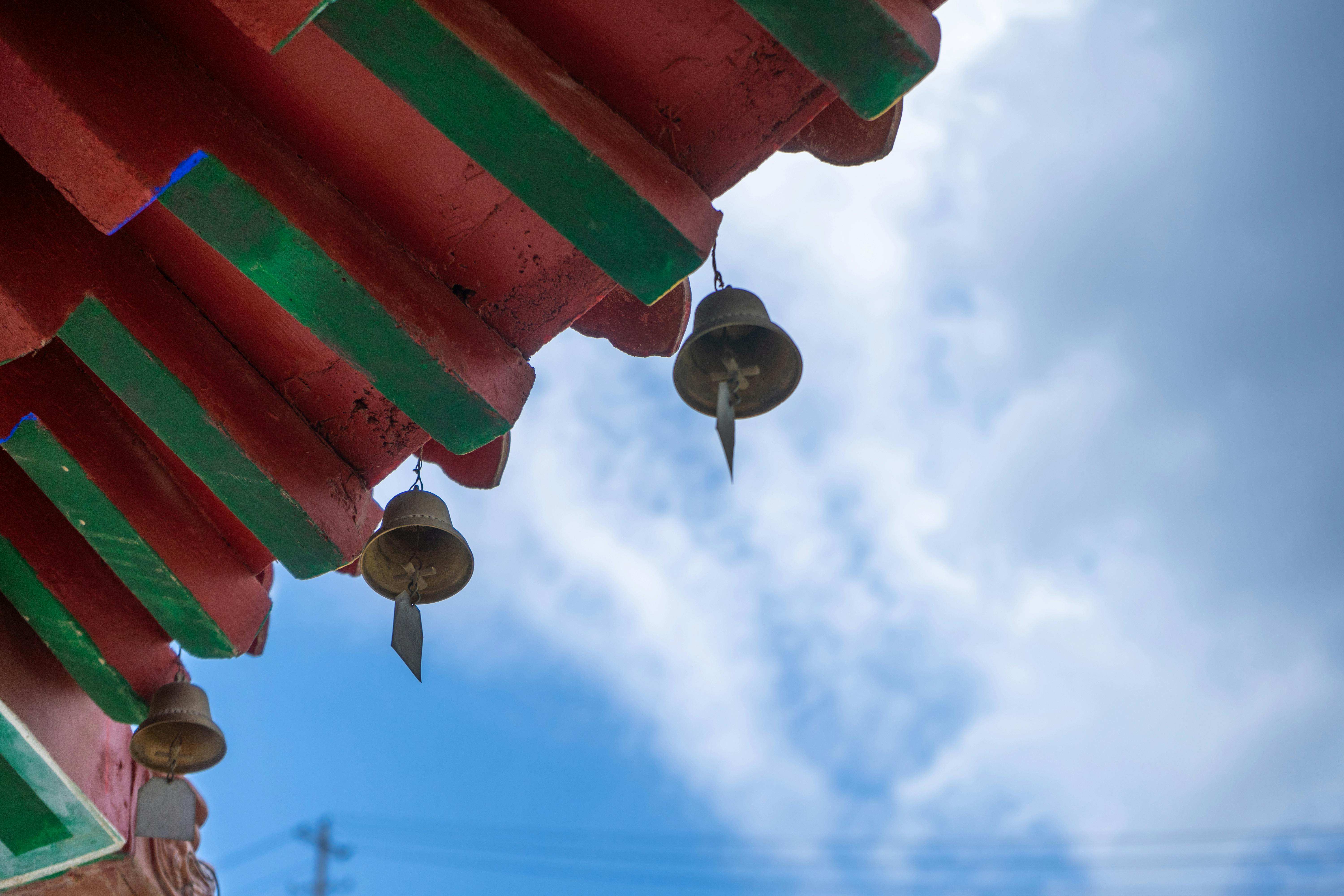 Bells Hanging of Rooftop · Free Stock Photo