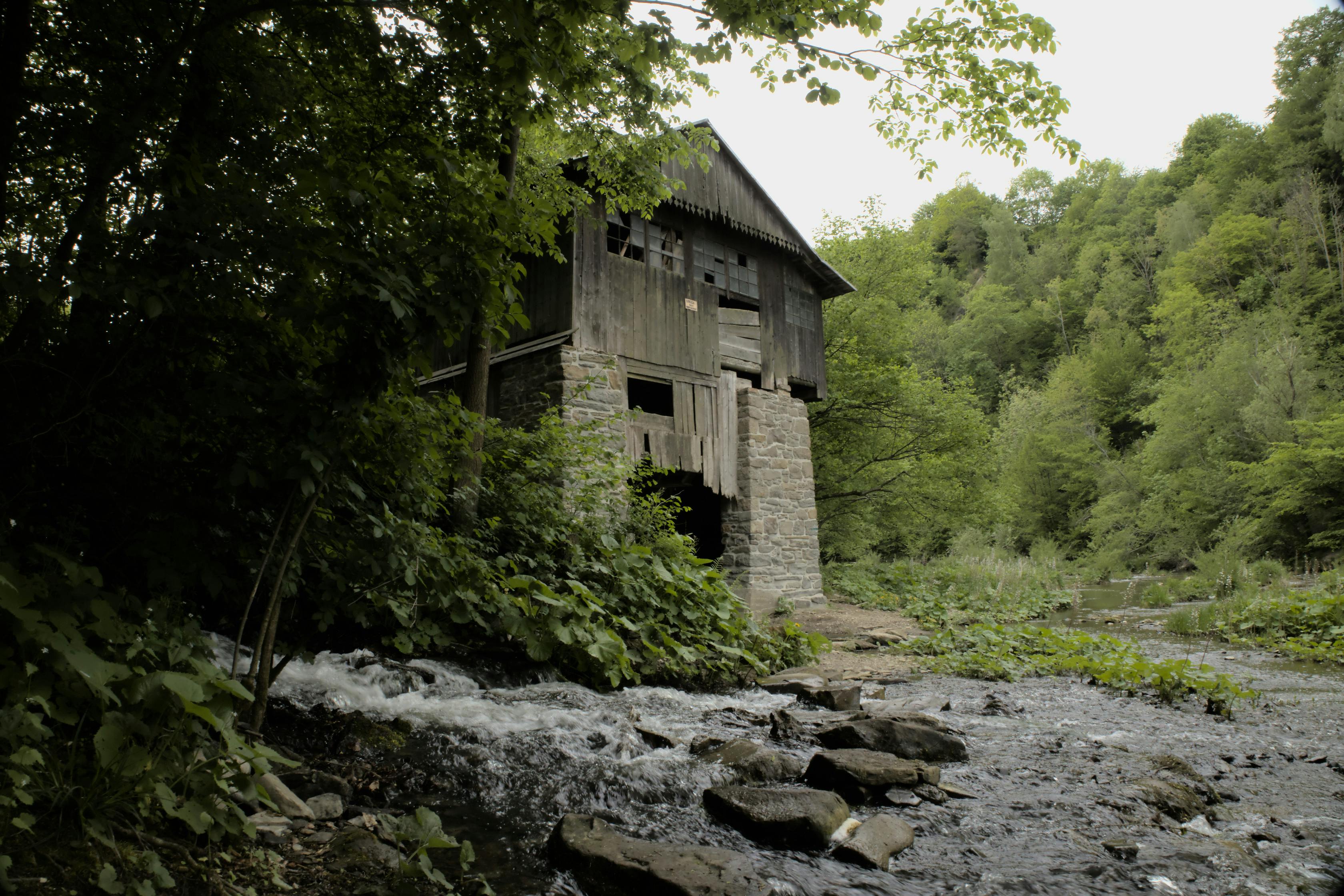 Broken Wooden House on Green Grass · Free Stock Photo
