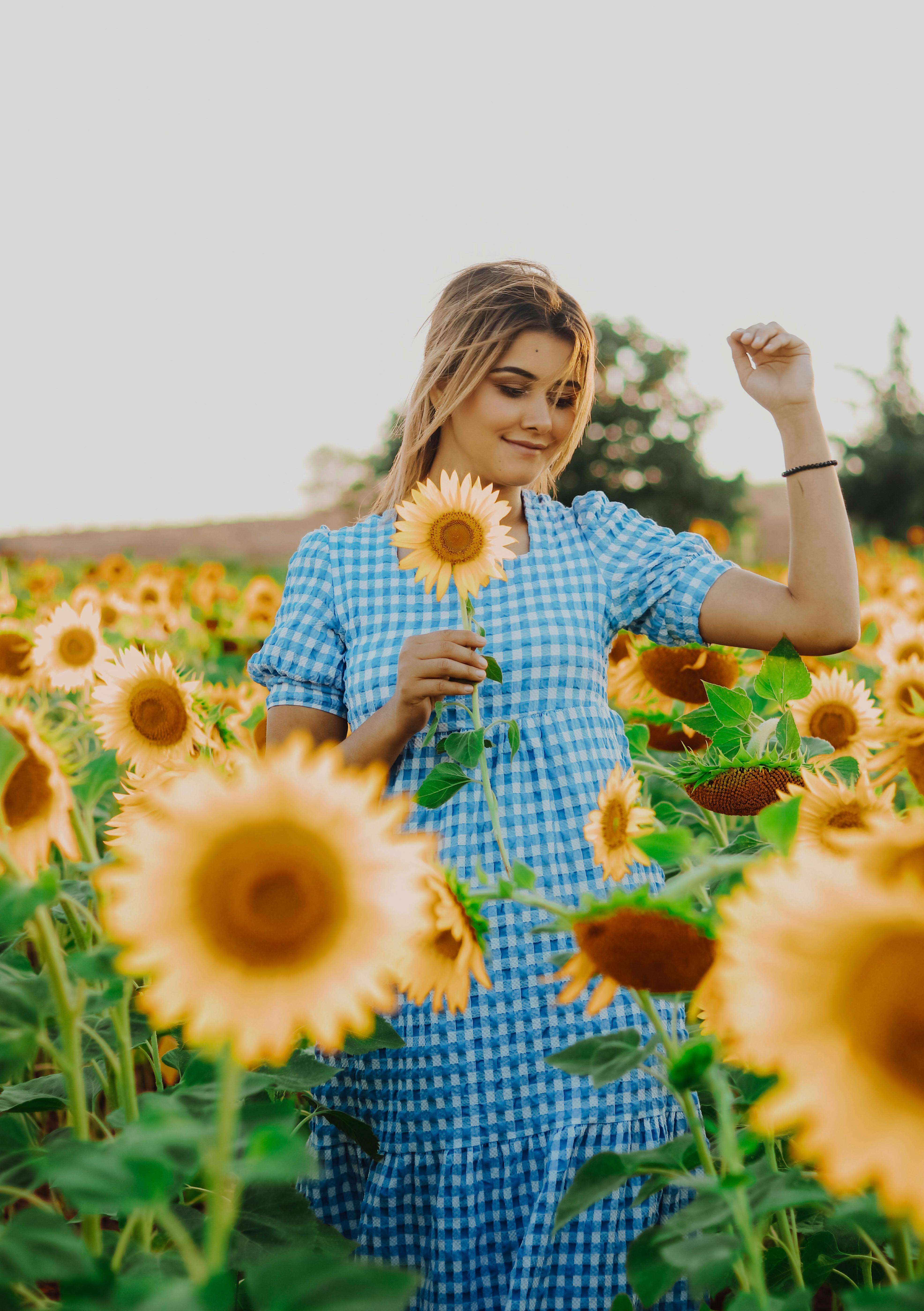 Woman Running Through a Field with Flowers · Free Stock Photo