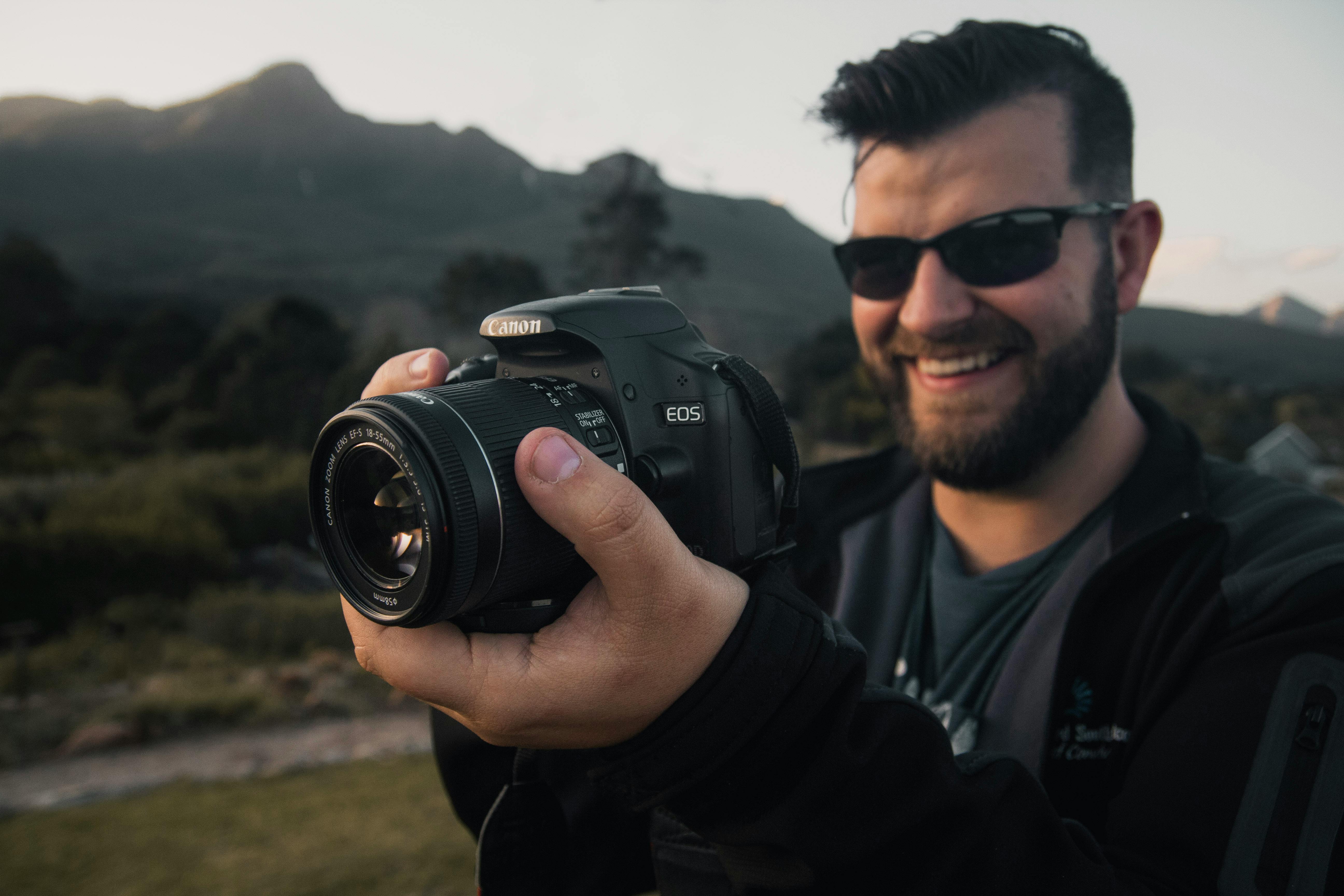 Woman Leaning Back on Tree Trunk Using Black Dslr Camera during Day ...