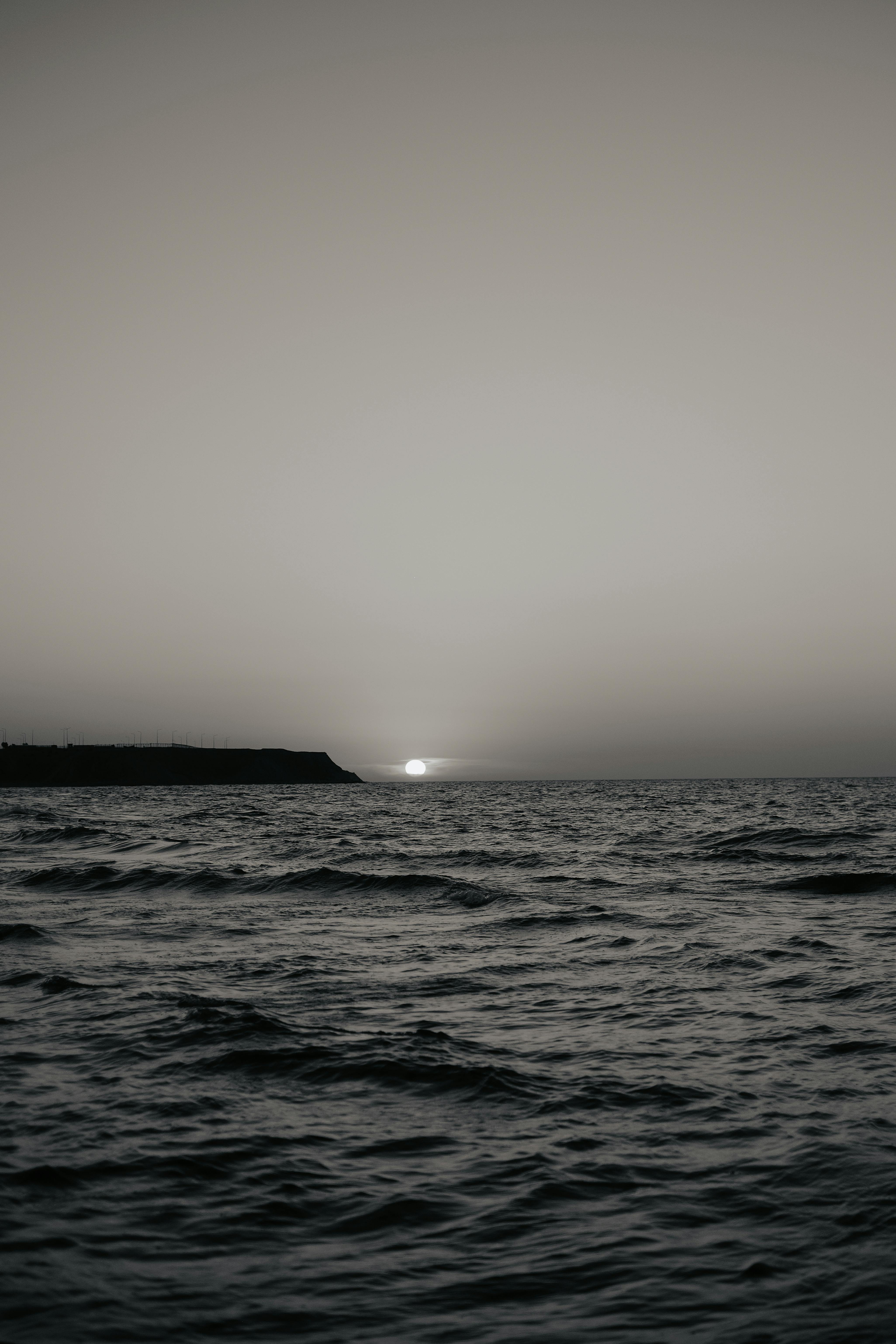 Grayscale Photo of Body of Water Under the Sun · Free Stock Photo