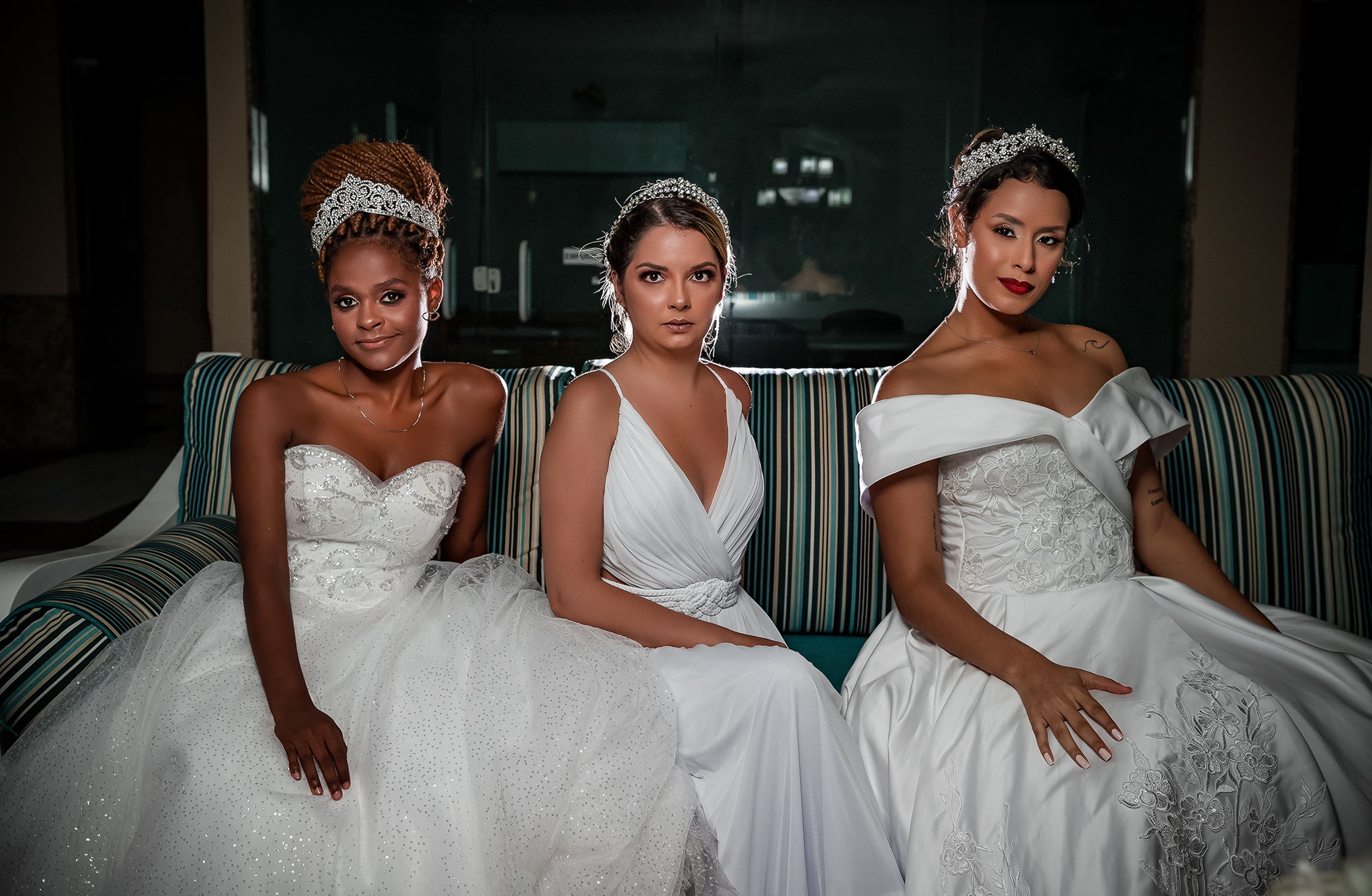 Three Women in White Wedding Dresses Sitting on Sofa · Free Stock Photo