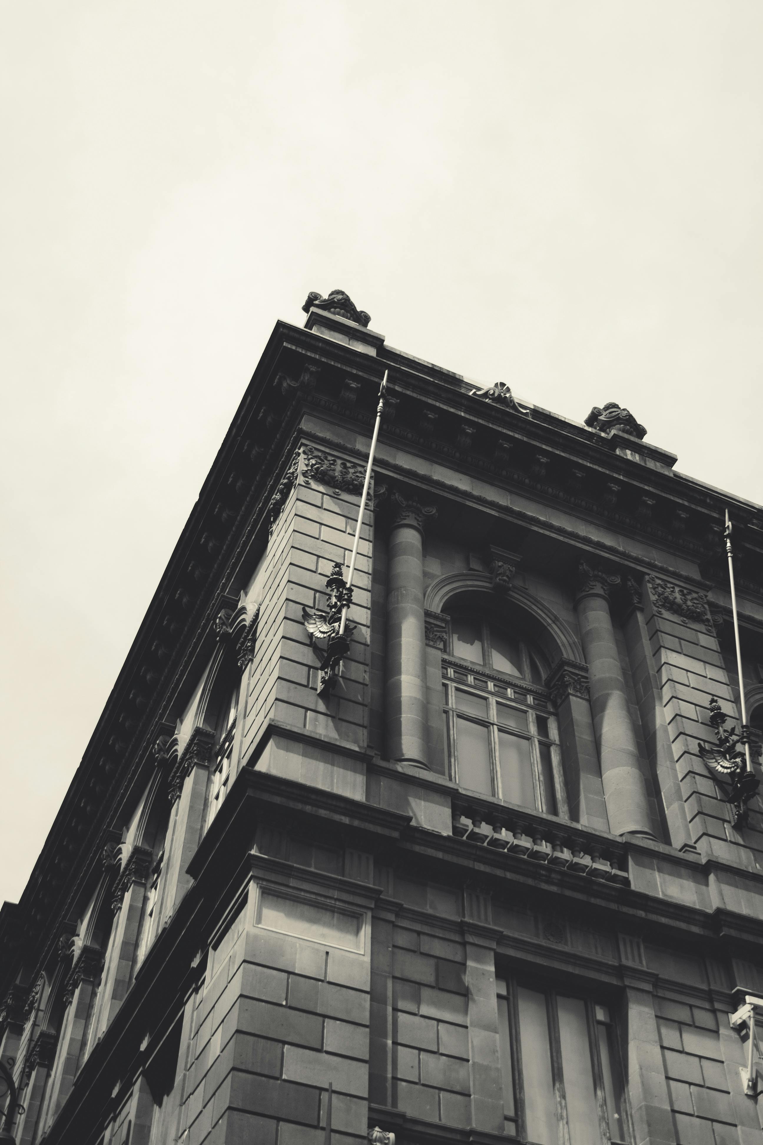 Grayscale Photo of Brick Buildings · Free Stock Photo