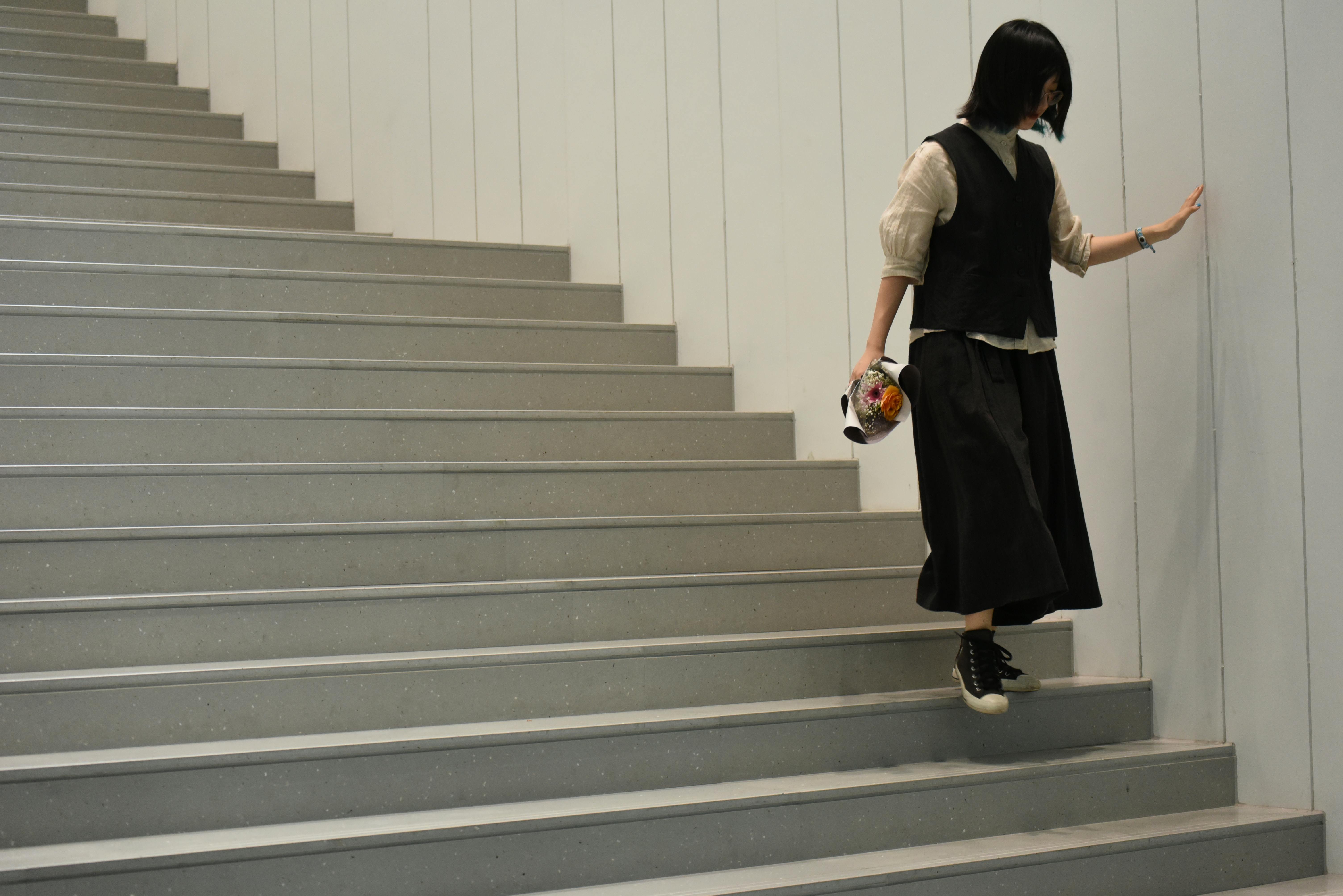 A Person Going Down Stairs · Free Stock Photo