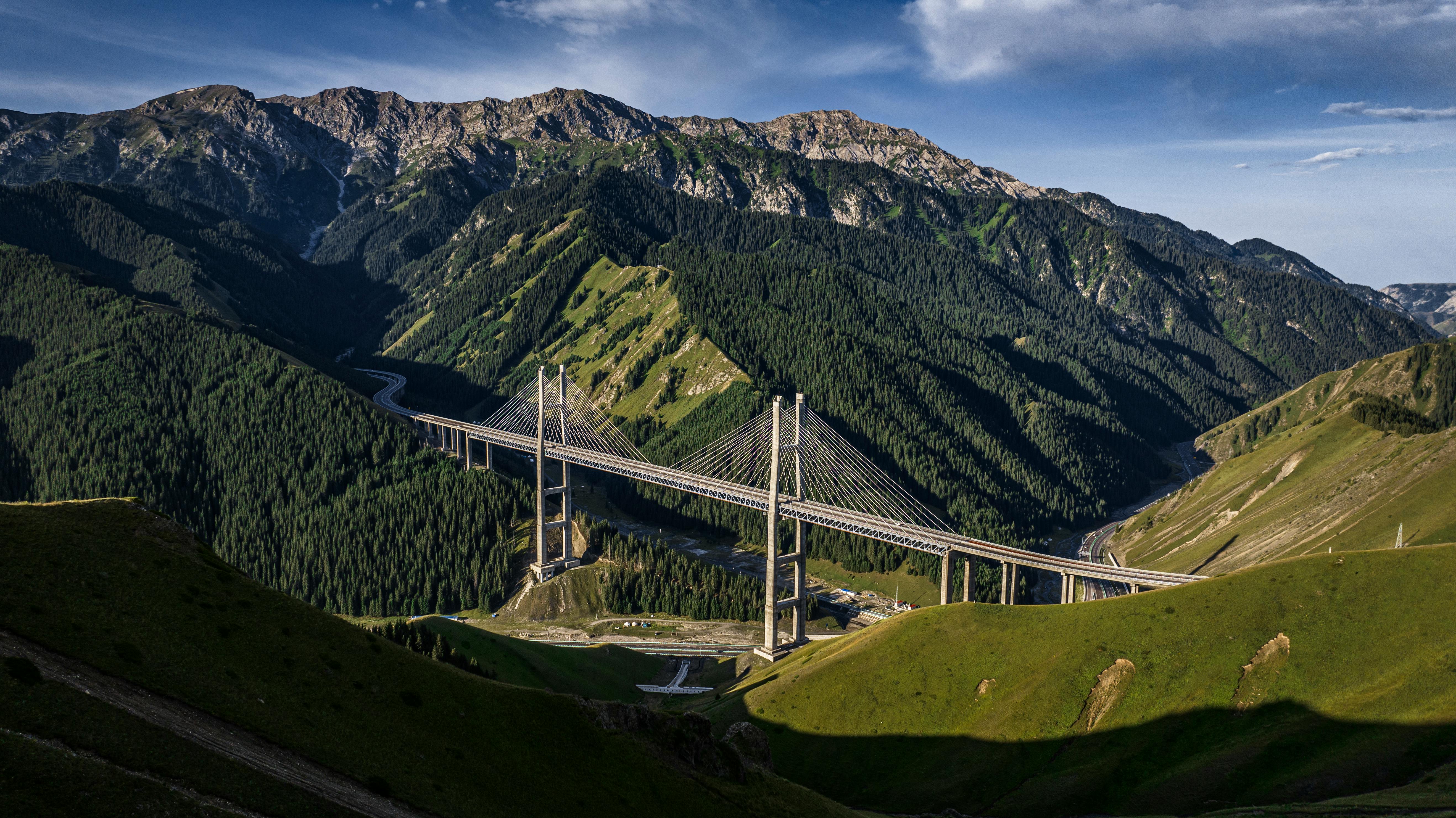 Suspension Bridge Between Mountains · Free Stock Photo