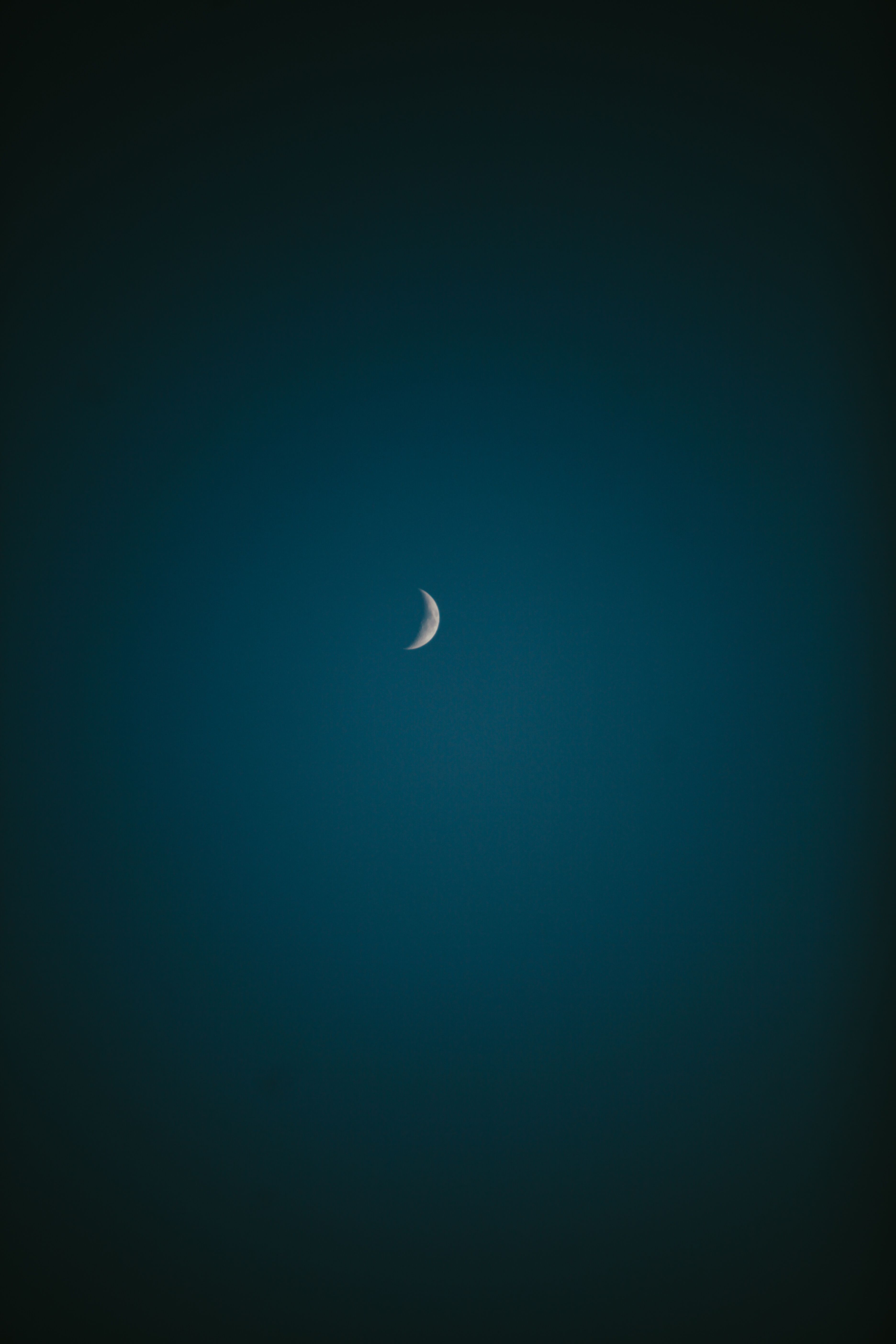 A Crescent Moon Across the Night Sky · Free Stock Photo