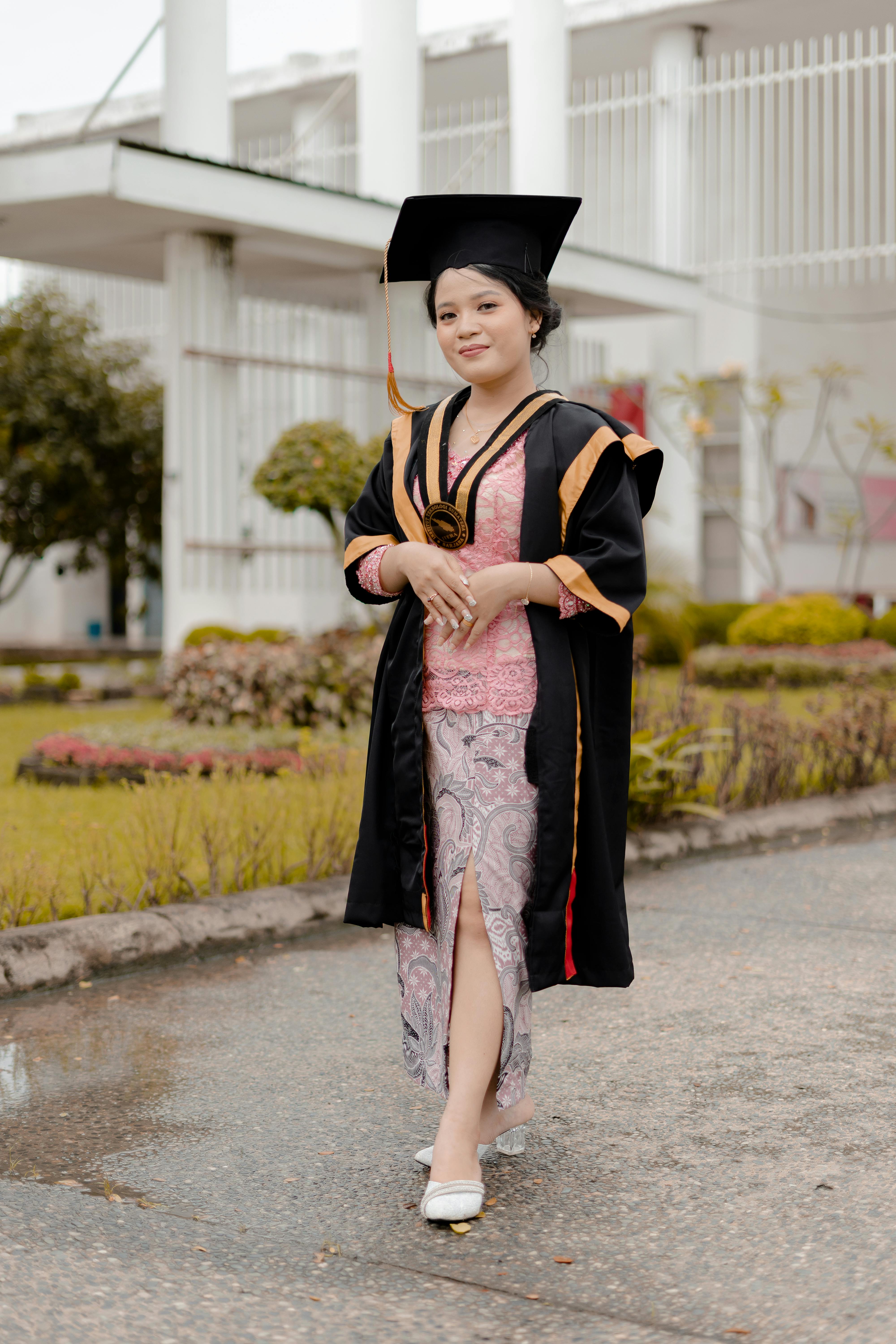 A Person Holding a Graduation Cap · Free Stock Photo