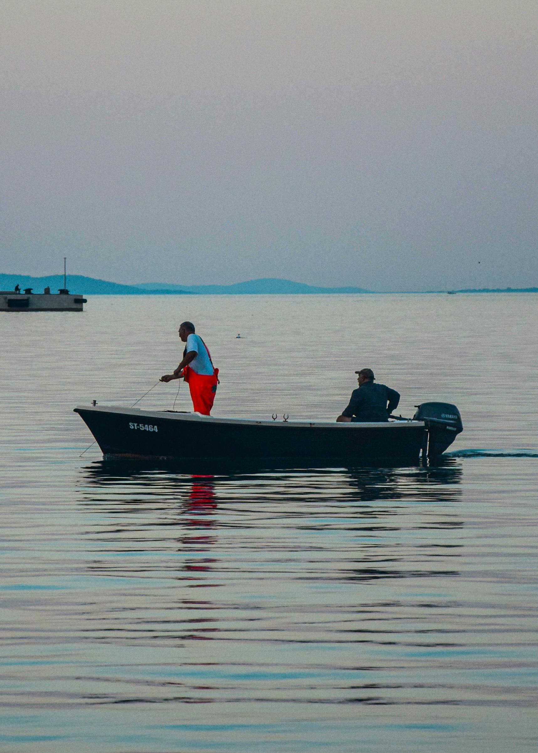 2 Person Riding Boat on Sea · Free Stock Photo