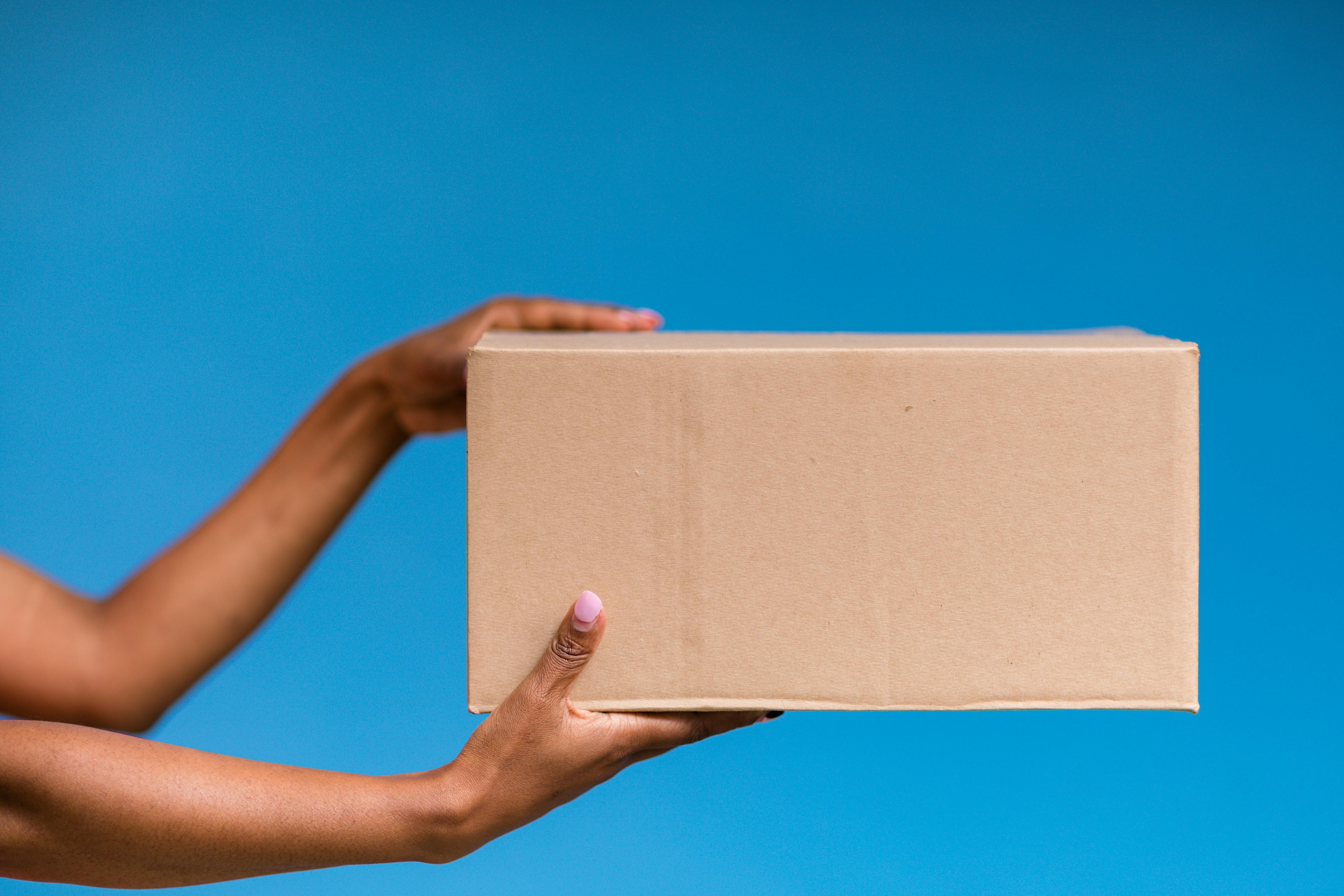 Carton Box held by a Person · Free Stock Photo